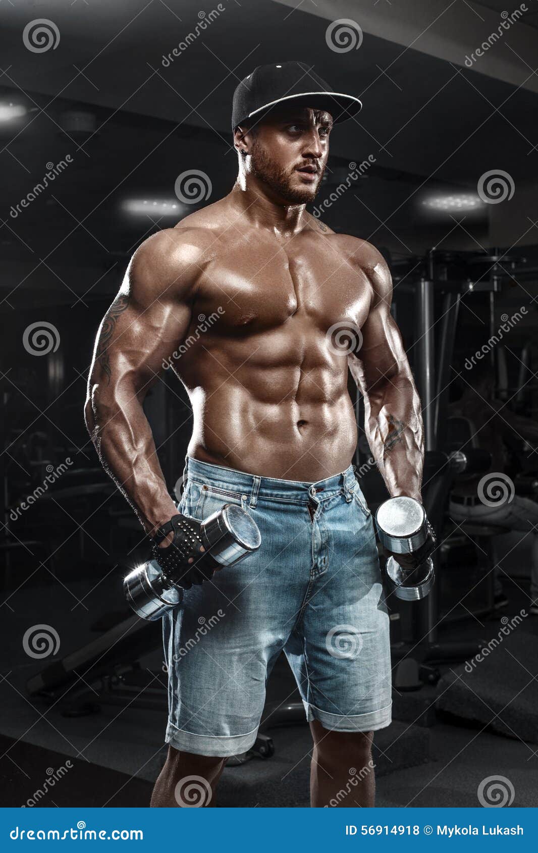 Handsome Muscular Man with Dumbbells Working Out in Gym, Doing Exercise ...