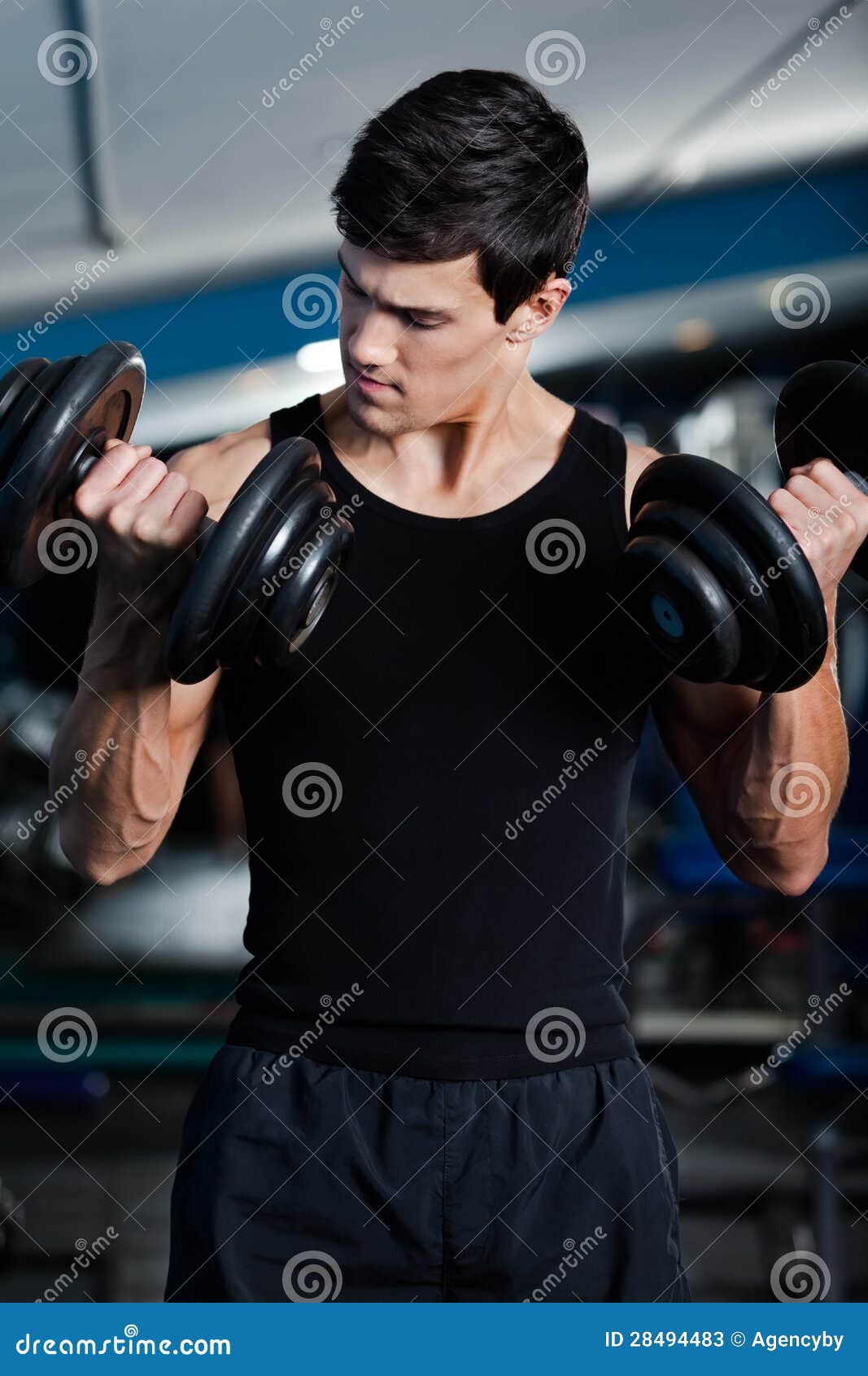 Handsome Muscular Man Uses His Dumbbells Stock Image - Image of ...