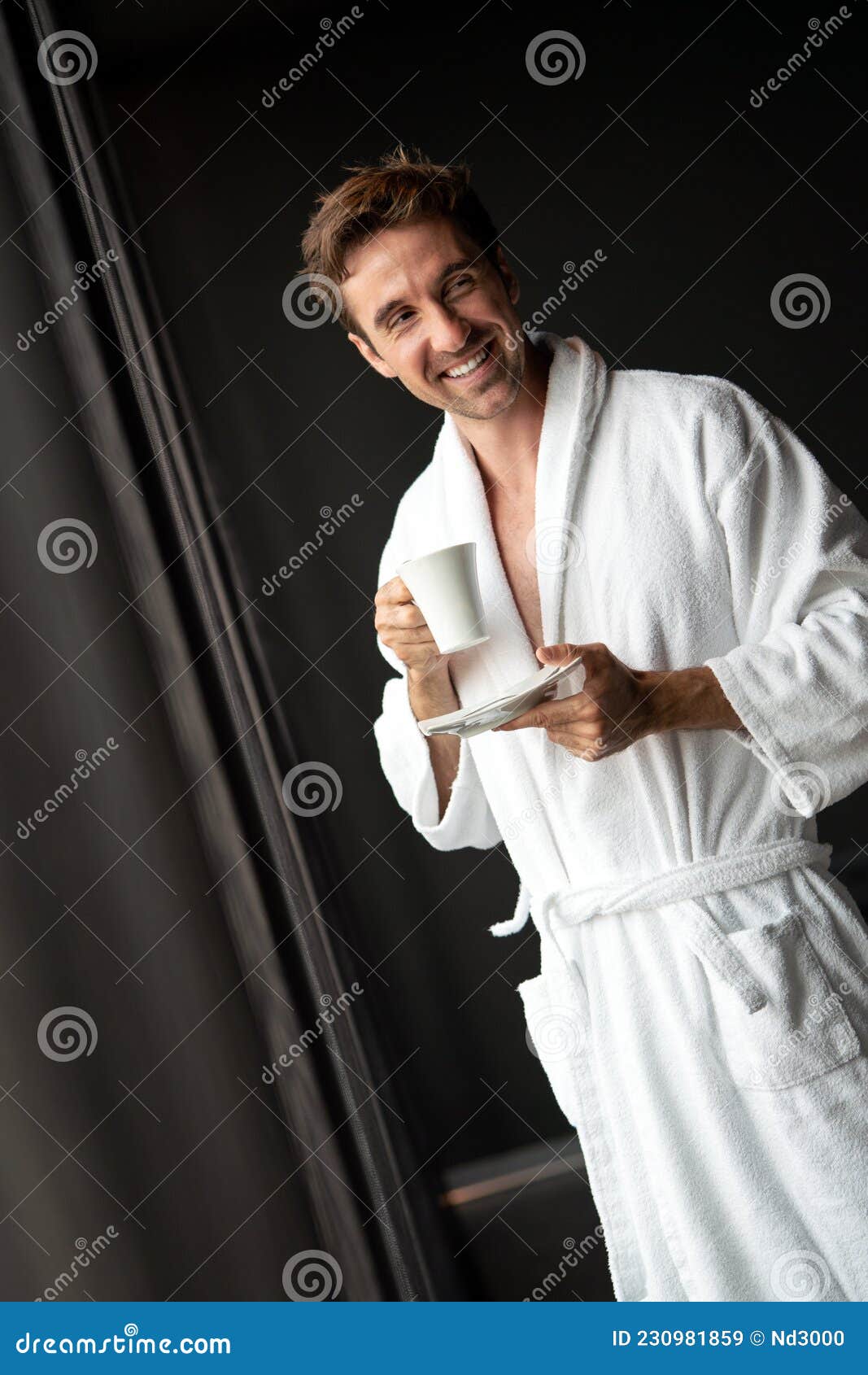 Handsome, Muscular, Young Man Drinking His Morning Coffee in a Hotel ... Handsome, Muscular, Young Man Drinking His Morning Coffee in a Hotel ...