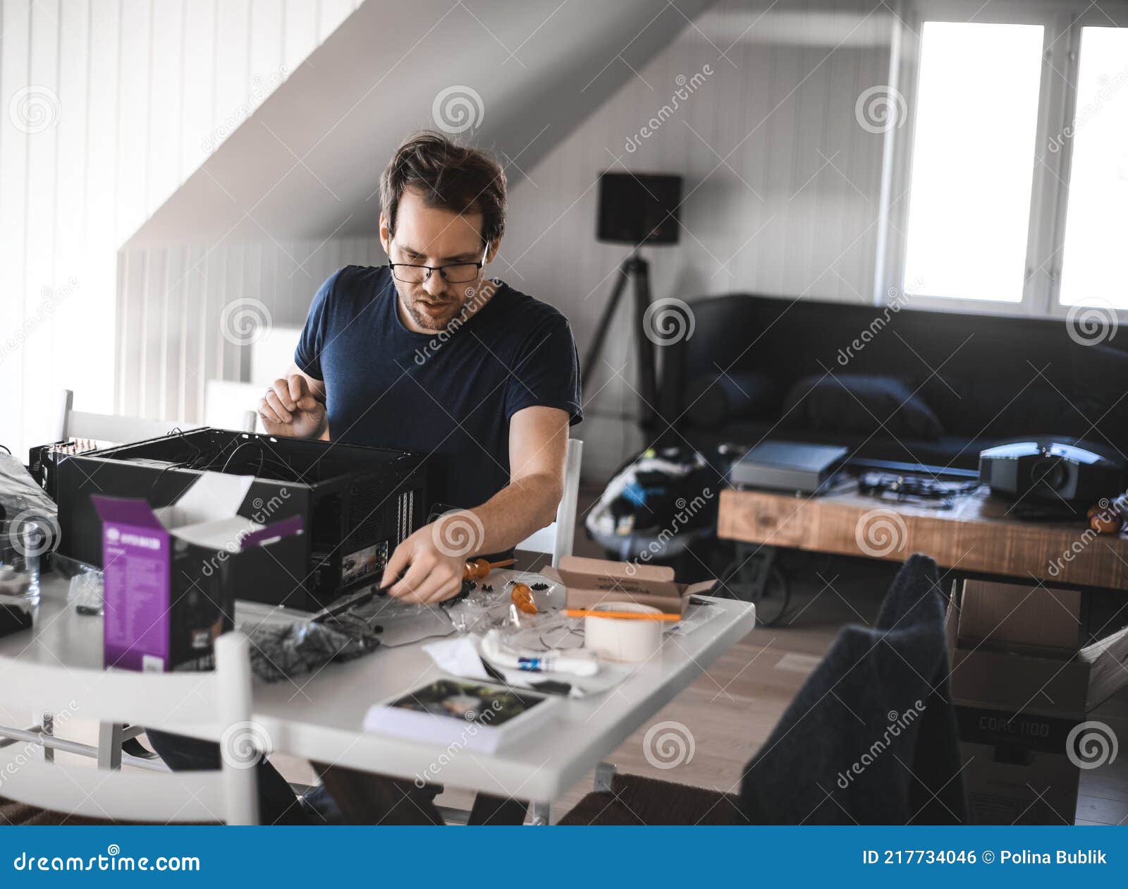 Handsome Nerd Man is Servicing Computer Motherboard and Cooler. Stock ...