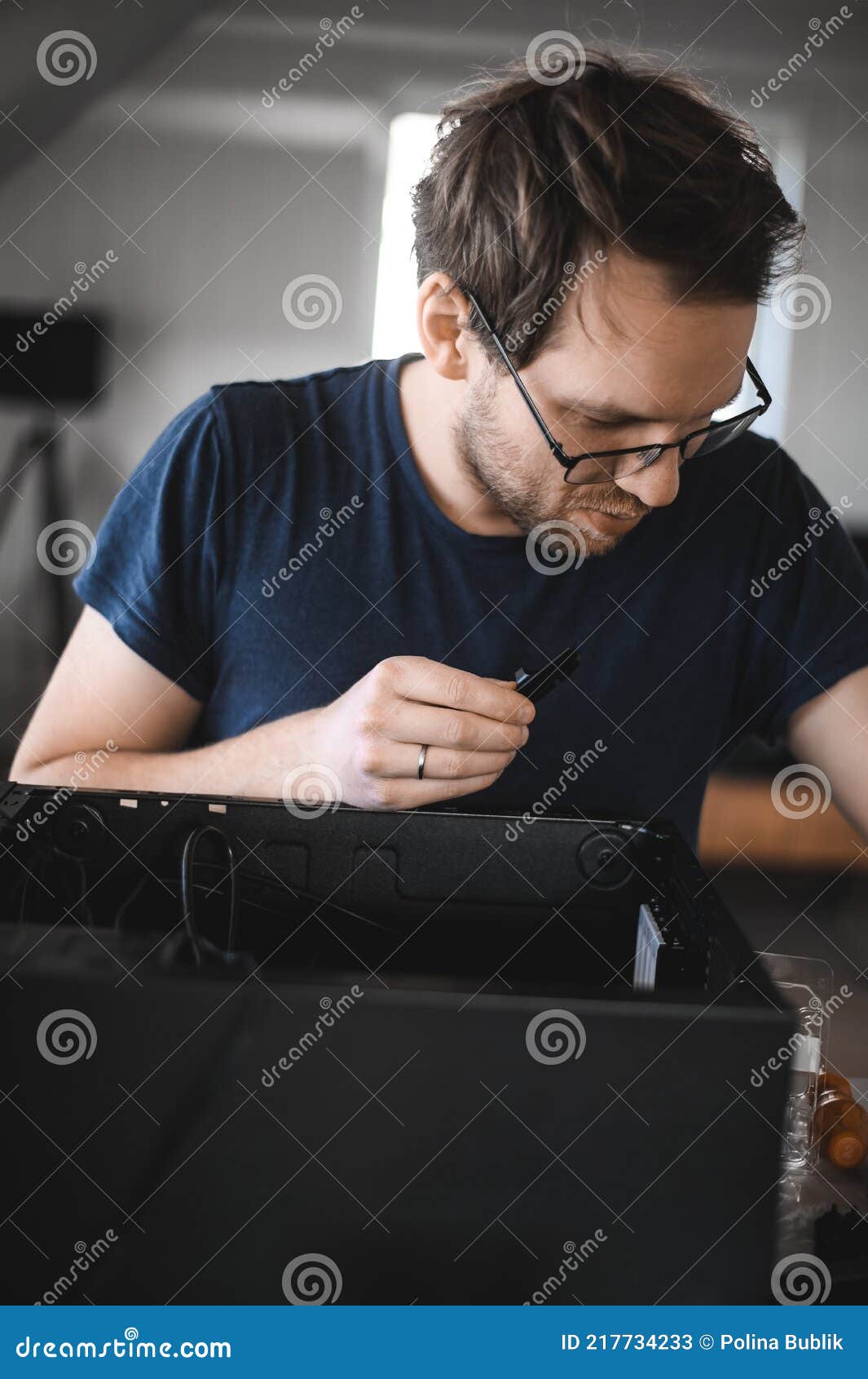 Handsome Nerd Man is Servicing Computer Motherboard and Cooler. Stock ...