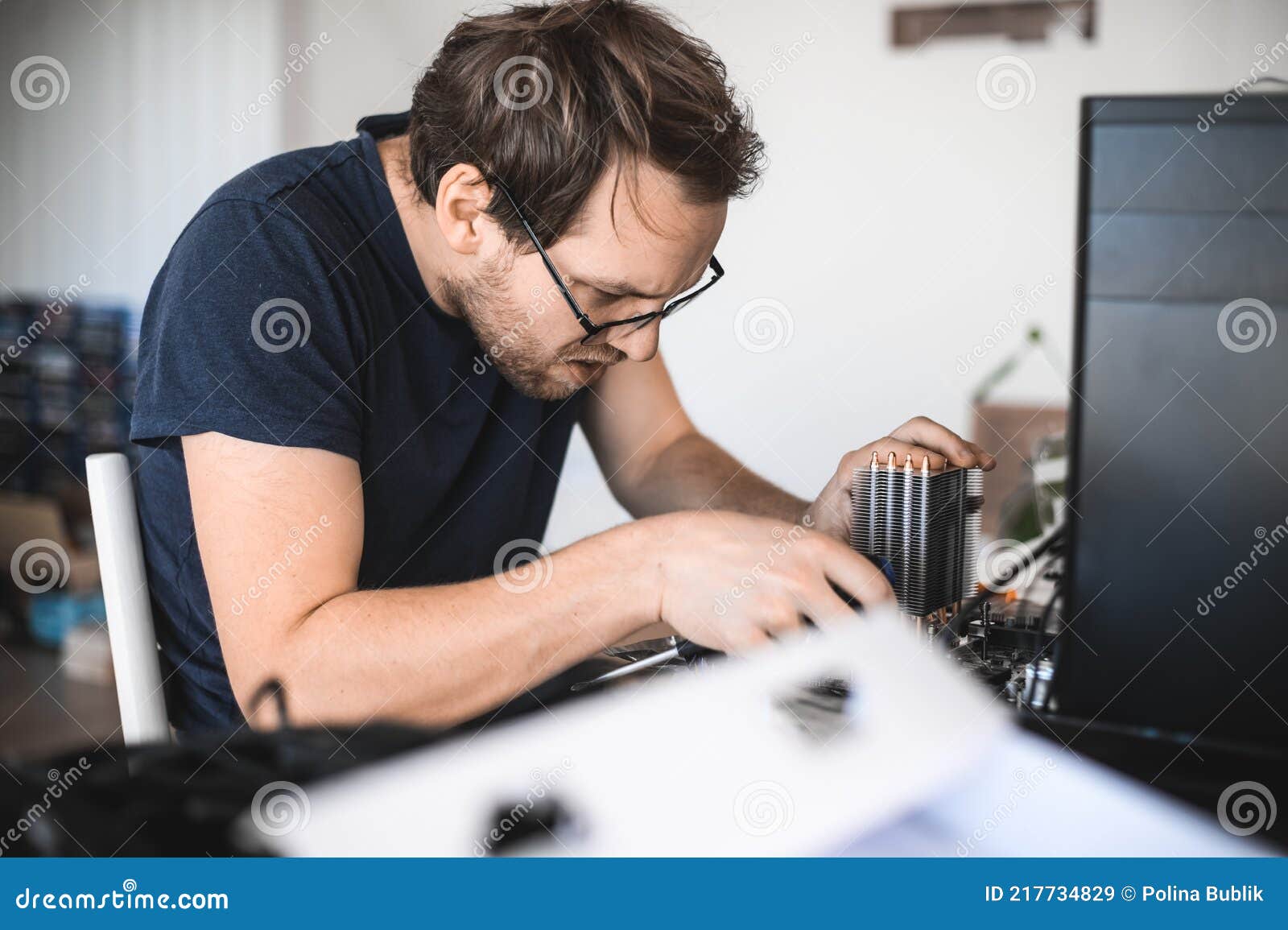 Handsome Nerd Man is Servicing Computer Motherboard and Cooler. Stock ...