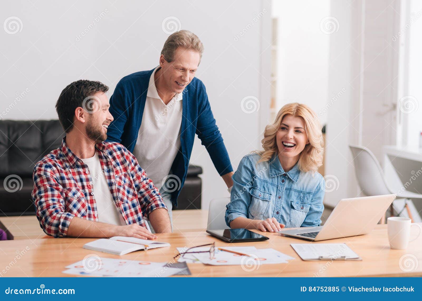 Handsome Nice Man Standing Behind His Colleagues Stock Image - Image of ...