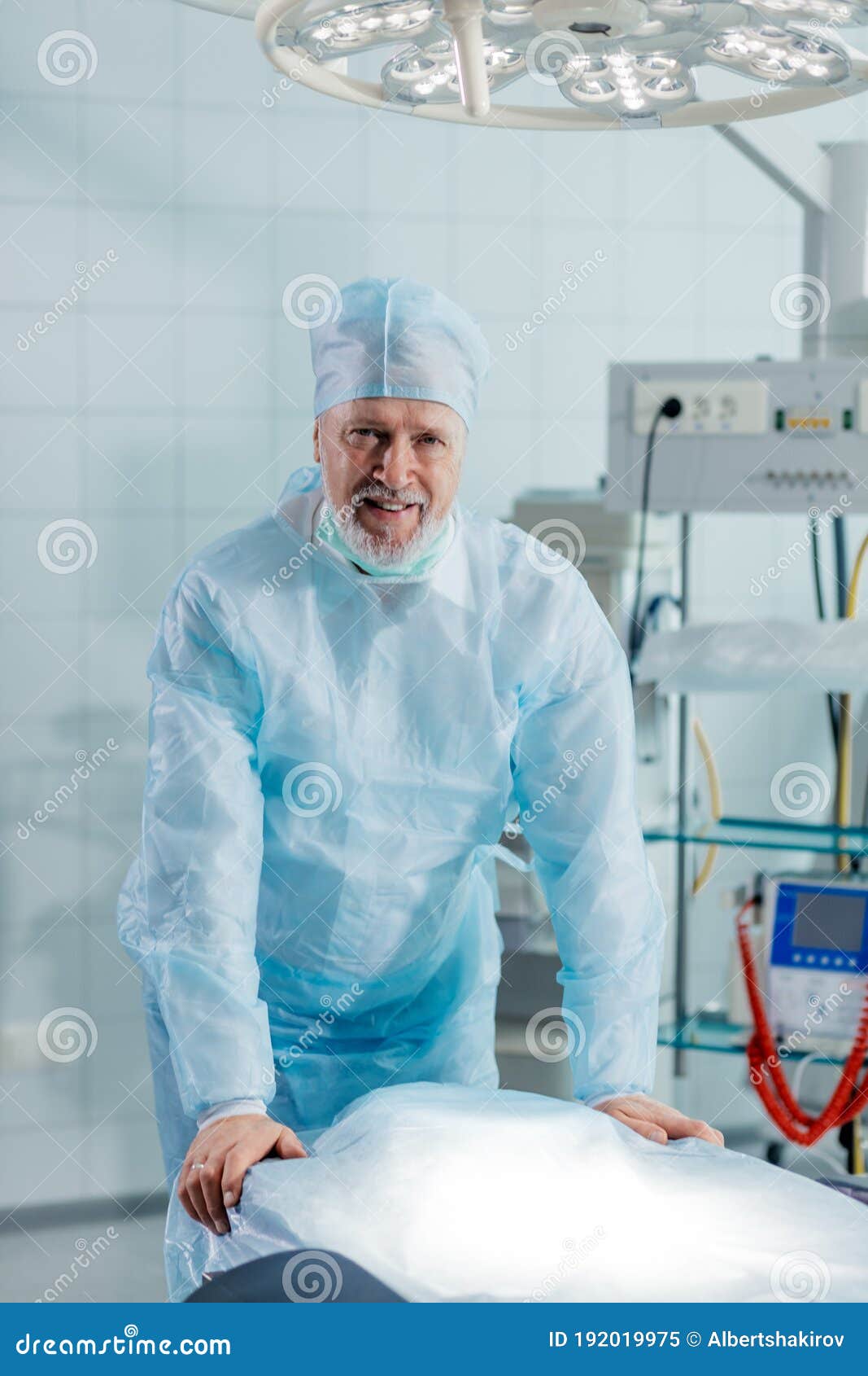 Handsome Old Bearded Surgeon Looking at Camera Aand Learning on the ...