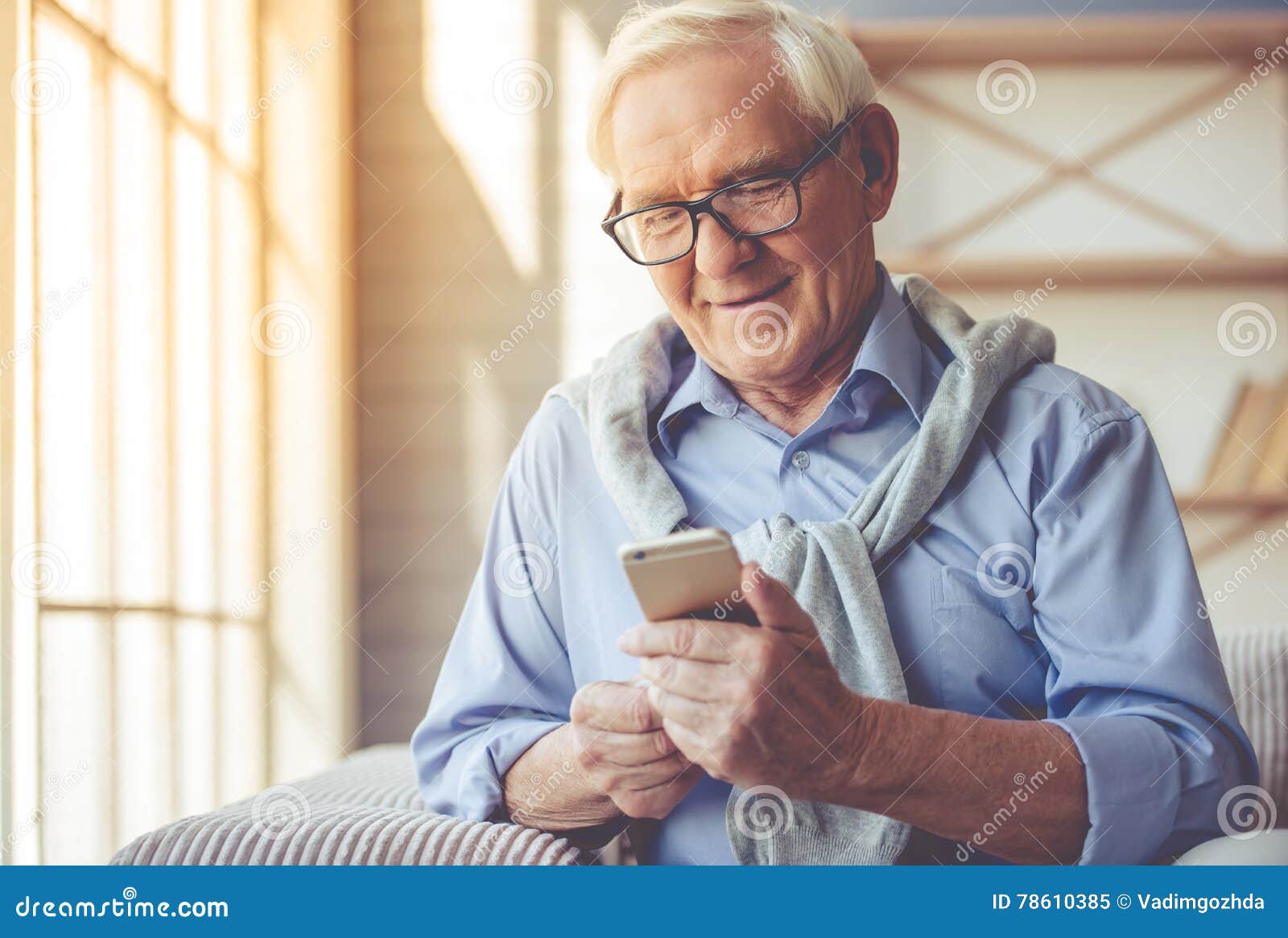 Handsome old man at home stock image. Image of manager - 78610385