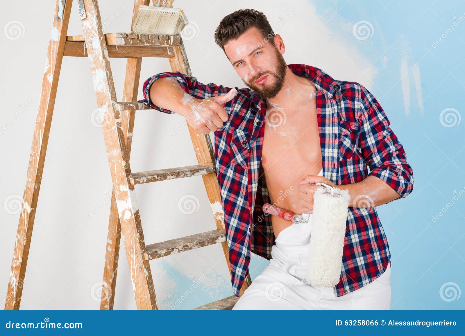 Handsome painter doing ok stock photo. Image of decorating - 63258066