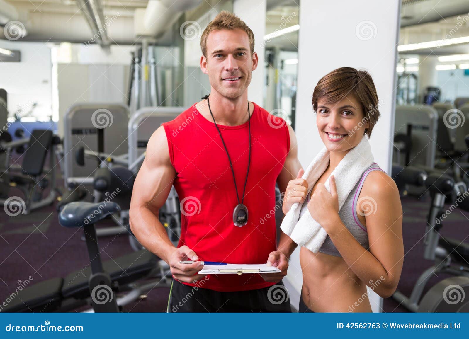 Handsome Personal Trainer with His Client Smiling at Camera Stock Image ...