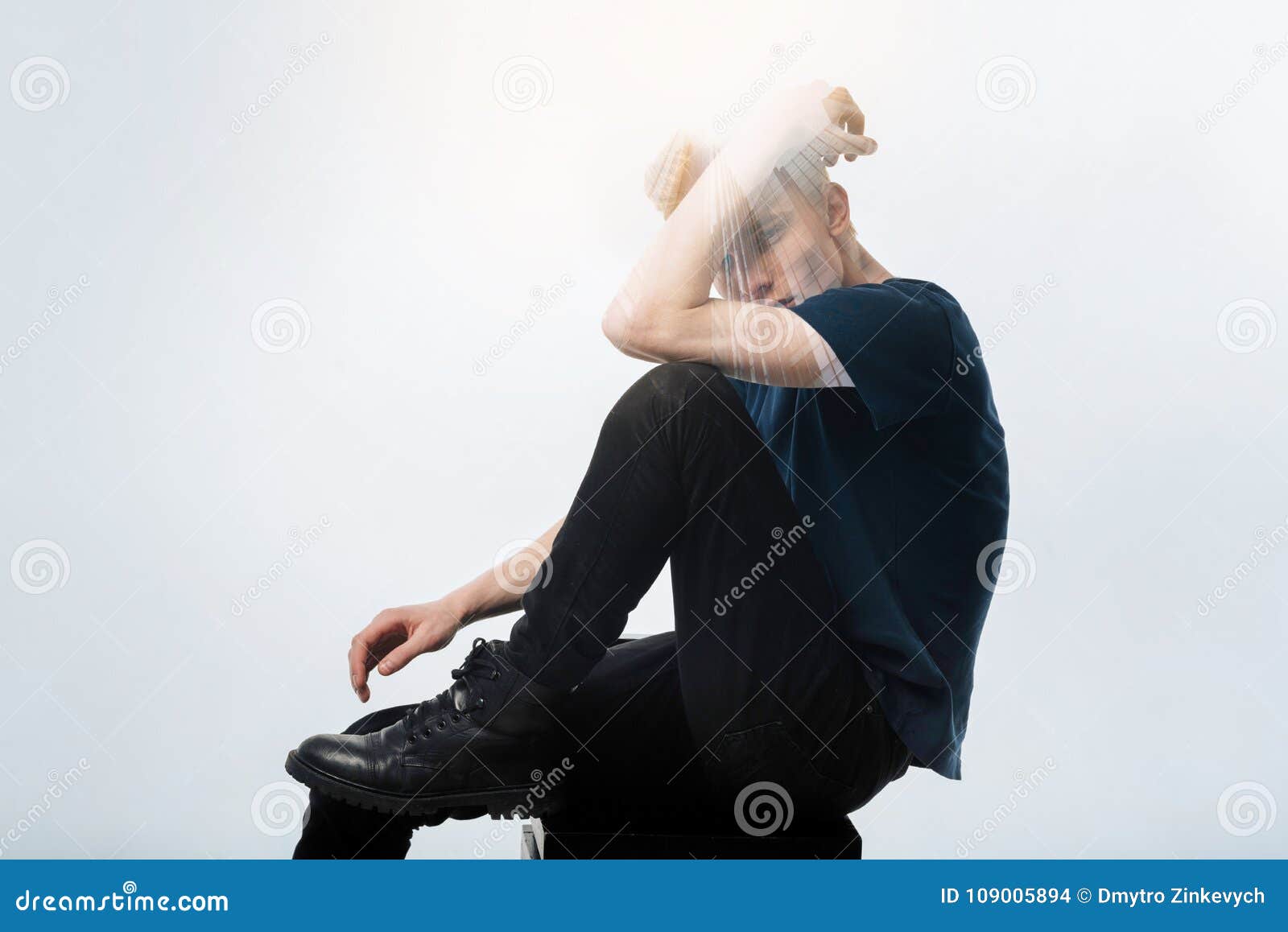 Handsome Perspective Model Sitting and Hiding Face by Hand. Stock Photo ...