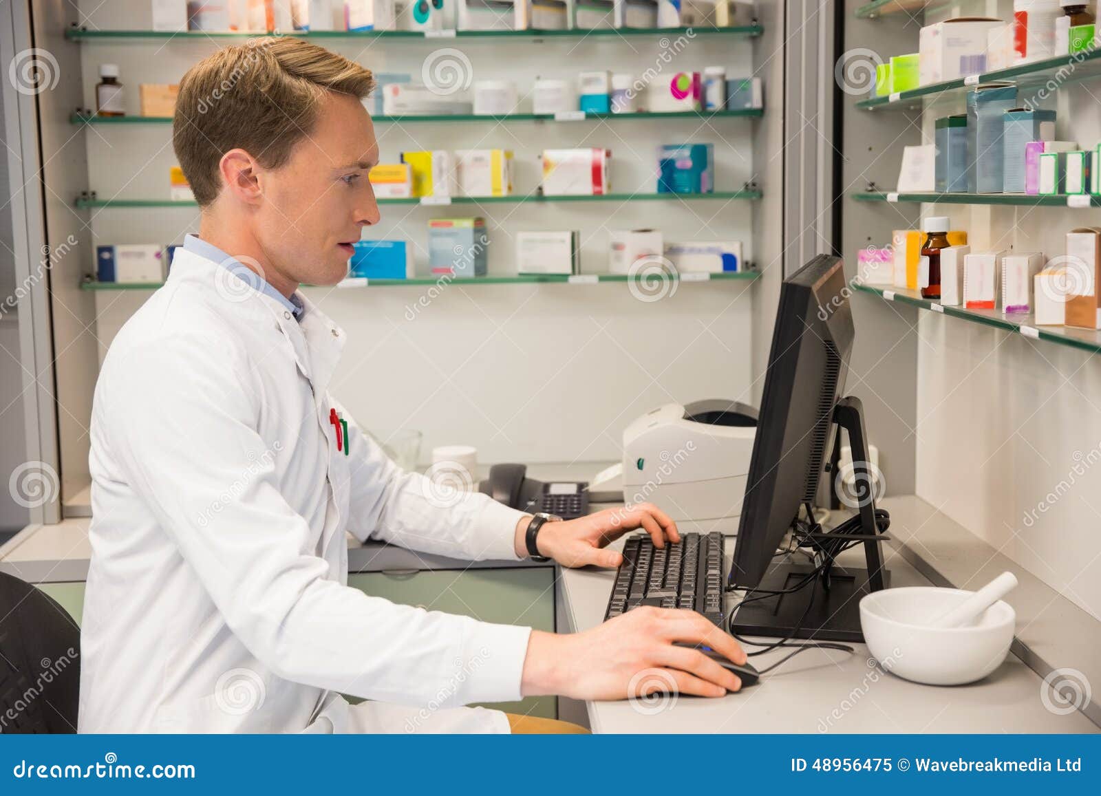 Handsome Pharmacist Using the Computer Stock Image - Image of sitting ...
