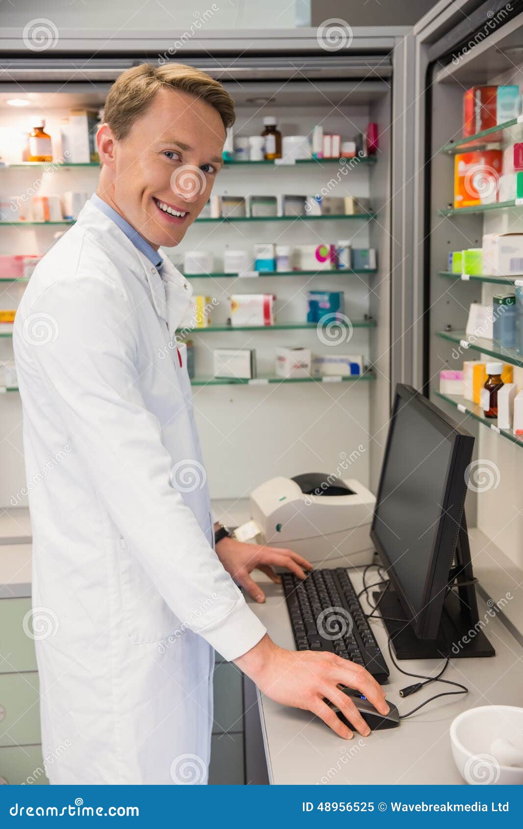 Handsome Pharmacist Using the Computer Stock Image - Image of ...