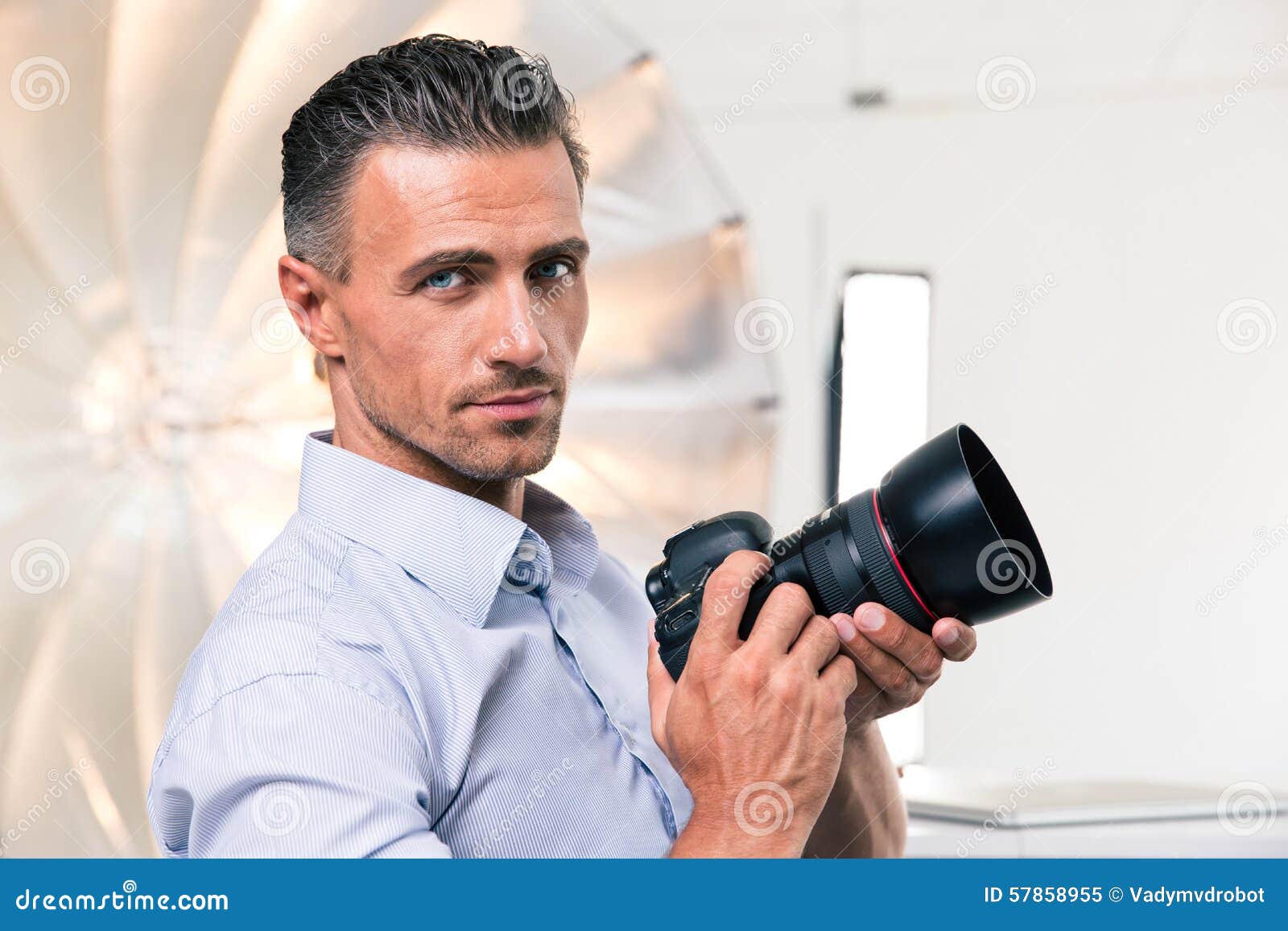 Handsome Photographer Holding Camera Stock Image - Image of lightning ...