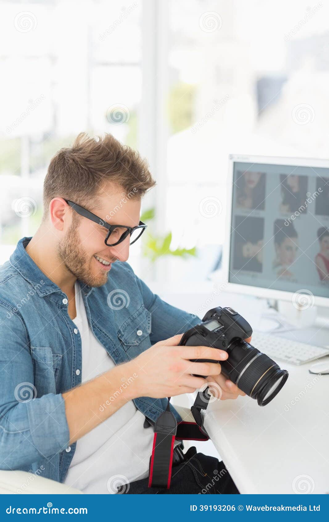 Handsome Photographer Holding His Camera and Smiling Stock Photo ...