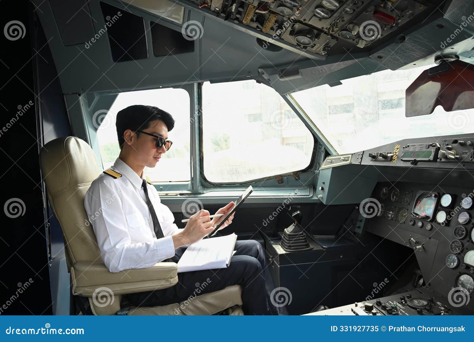 Handsome Pilot Wearing Sunglasses Using Digital Tablet, Preparing for ...