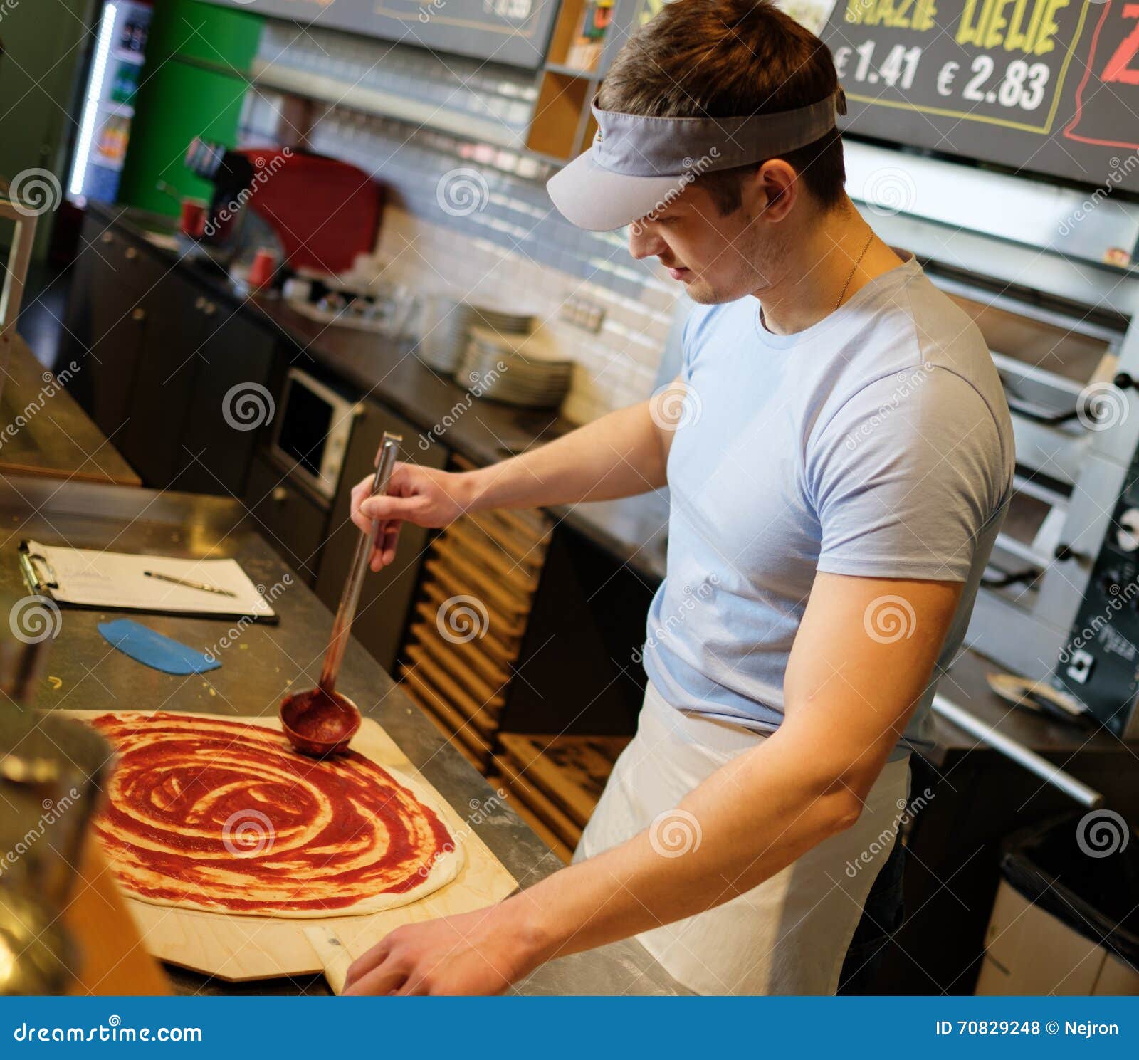 Handsome Pizzaiolo Making Pizza at Kitchen in Pizzeria. Stock Photo ...