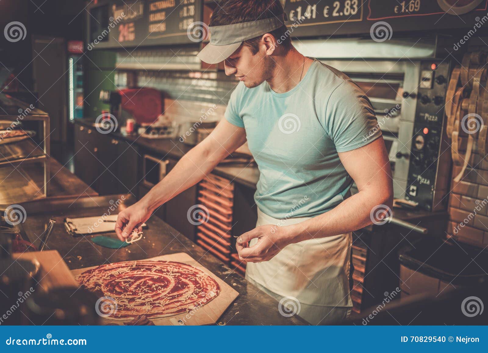 Handsome Pizzaiolo Making Pizza at Kitchen in Pizzeria. Stock Photo ...