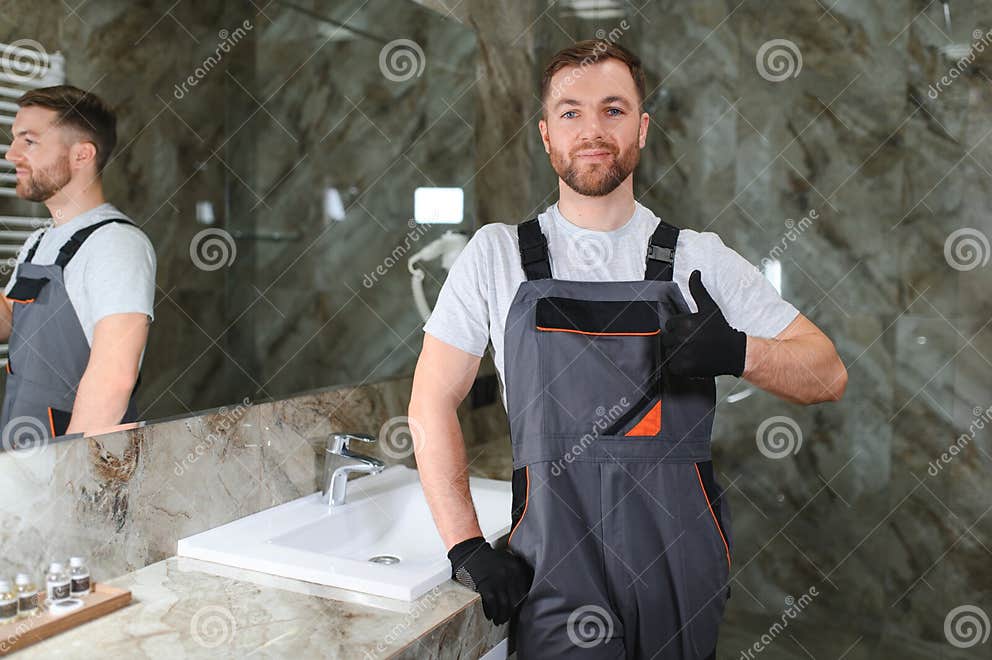 Handsome Plumber Working in Restroom Stock Photo - Image of home ...
