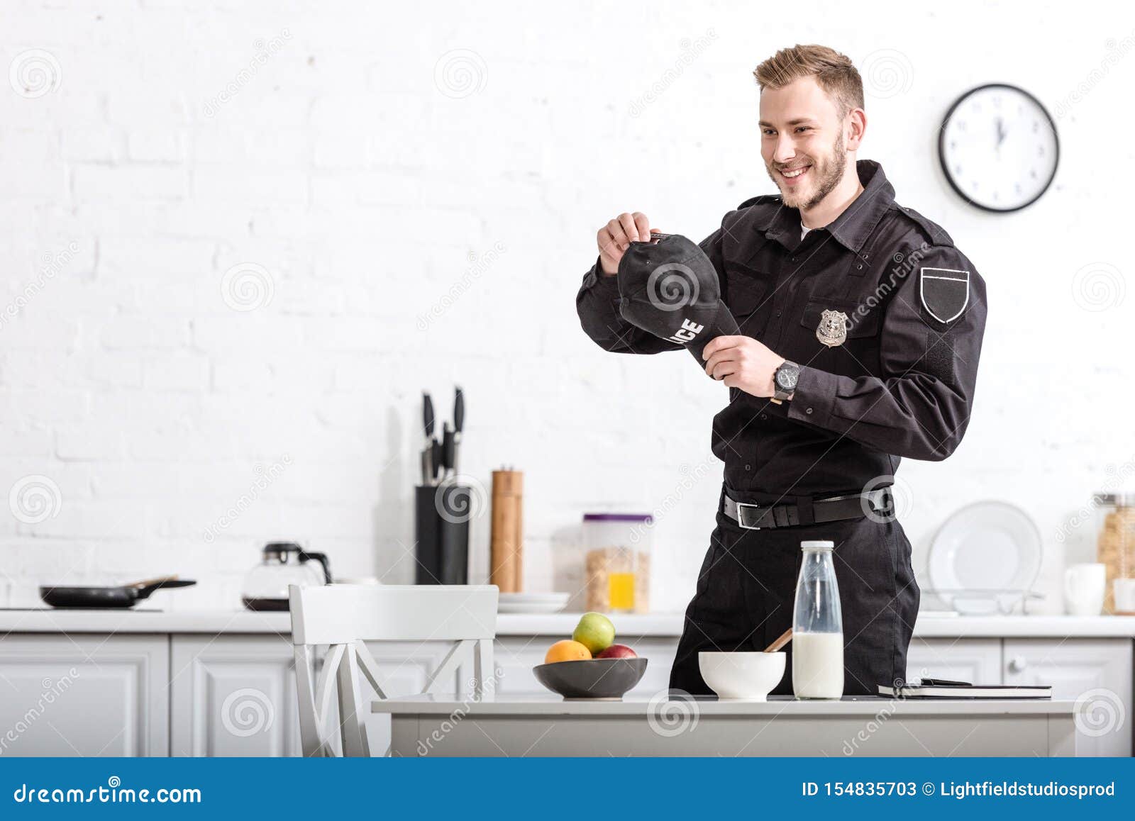 Handsome Police Officer with Cap in Hands Smiling Stock Image - Image ...