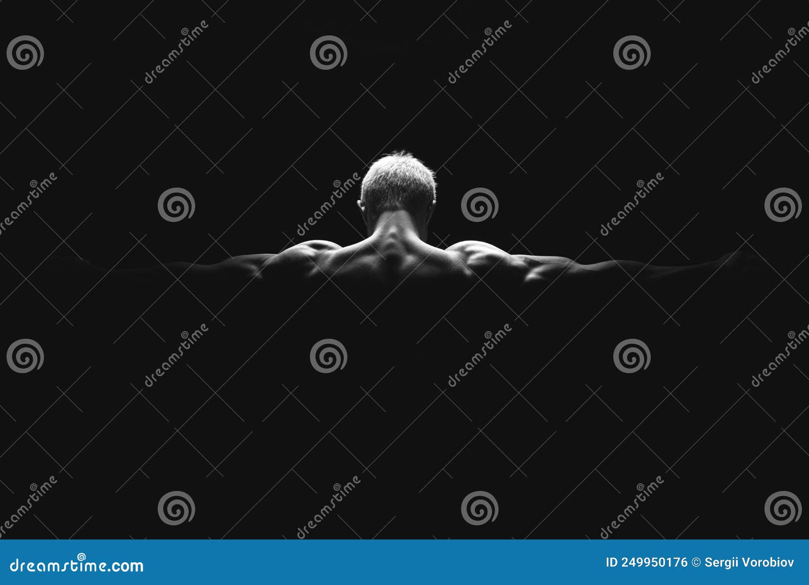 Handsome Power Athletic Man in Dramatic Light. Strong Bodybuilder with ...