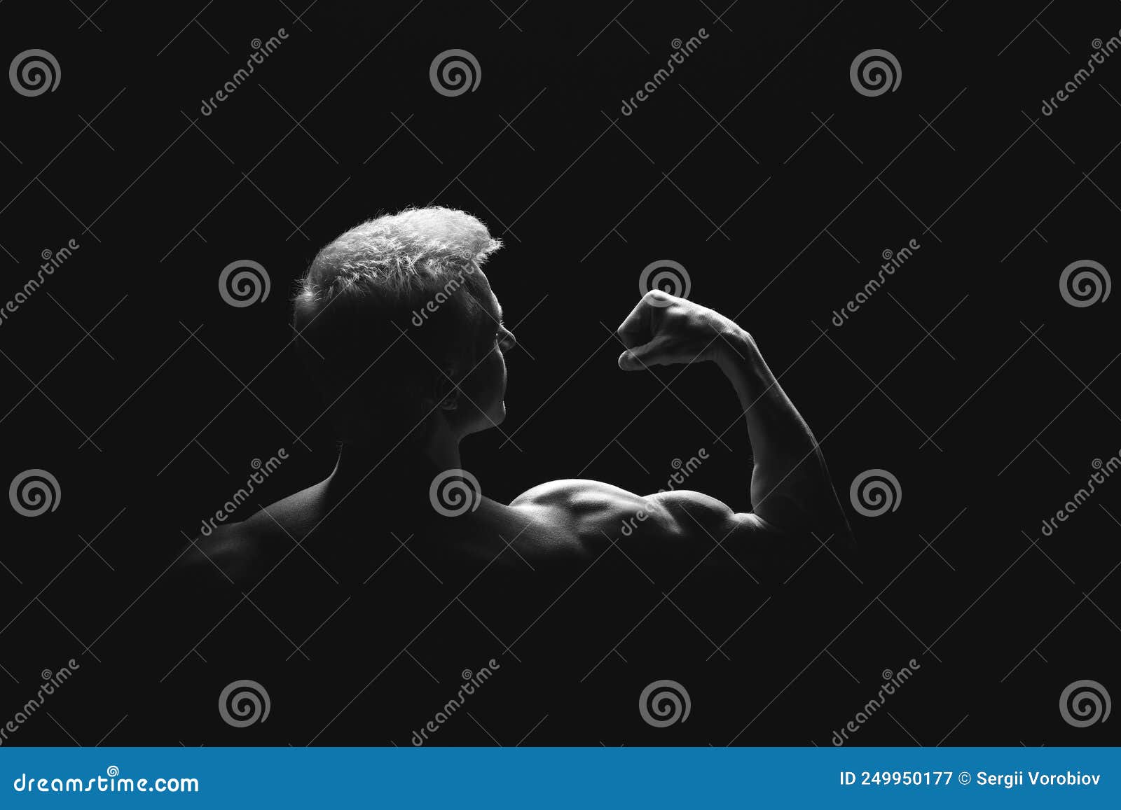 Handsome Power Athletic Man in Dramatic Light. Strong Bodybuilder with ...