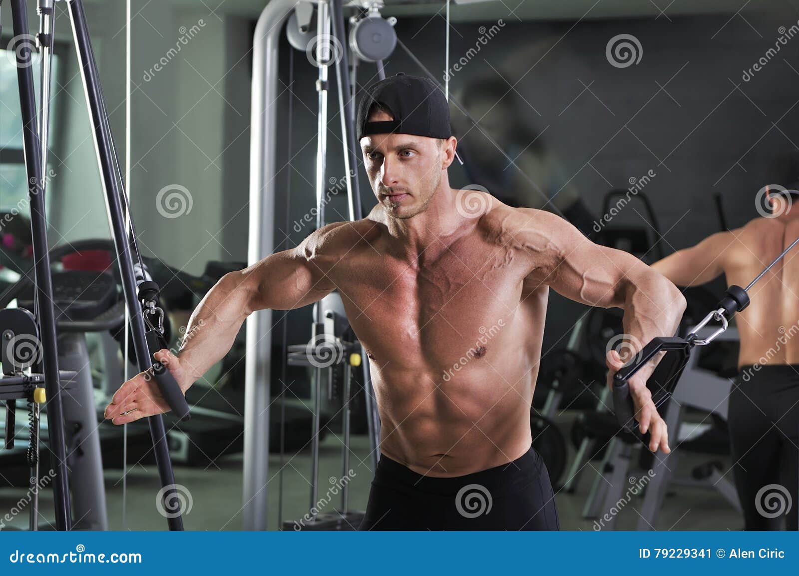 Handsome Powerful Athletic Man Doing Cable Crossover Exercise. Stock ...