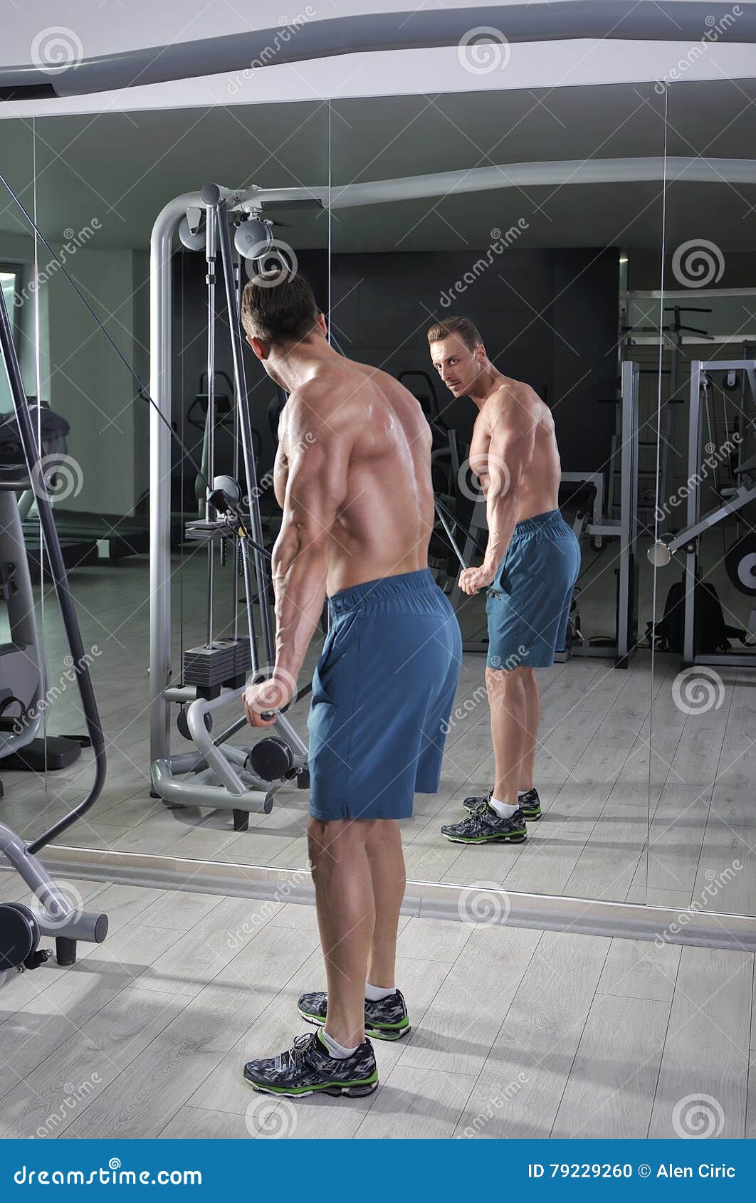 Handsome Powerful Athletic Man Doing Triceps Exercise. Stock Photo ...
