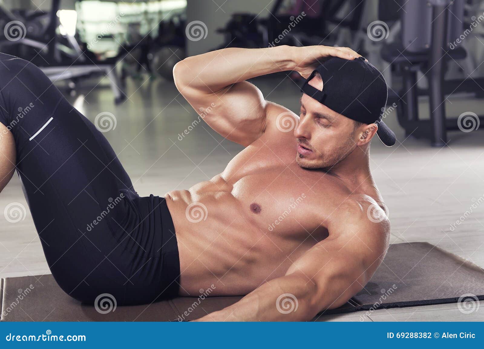 Handsome Powerful Athletic Man Performing Crunches. Stock Photo - Image ...