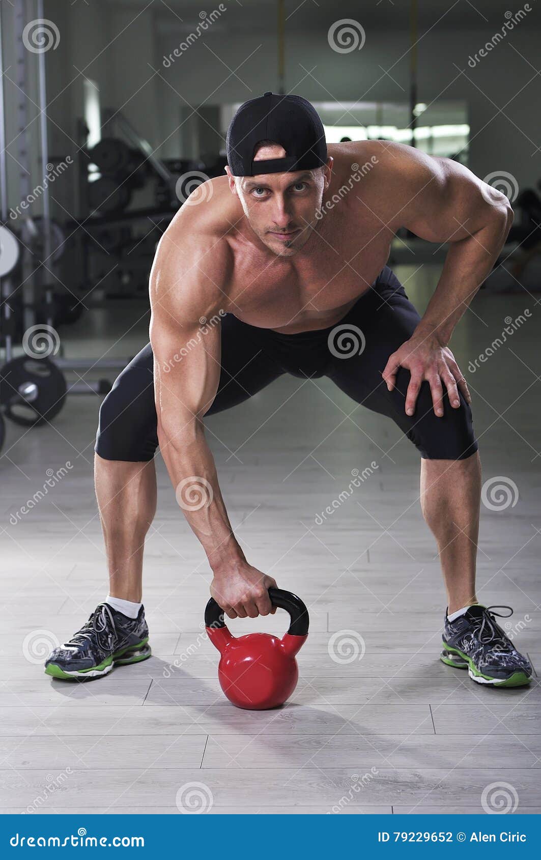 Handsome Powerful Athletic Man Performing Kettle Bell Exercise. Stock ...