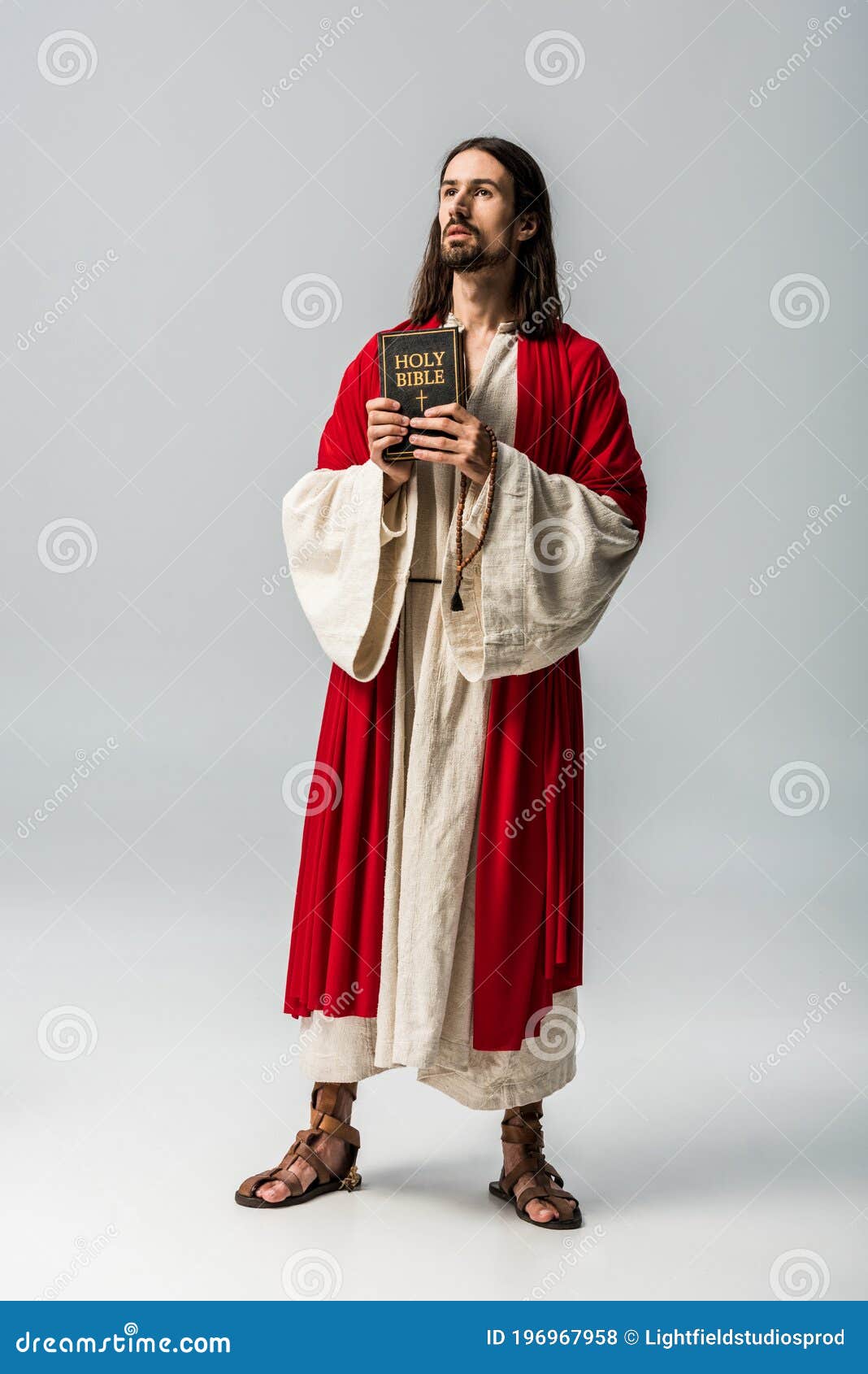 Religious Man Holding Holy Bible on Grey Stock Photo - Image of ...