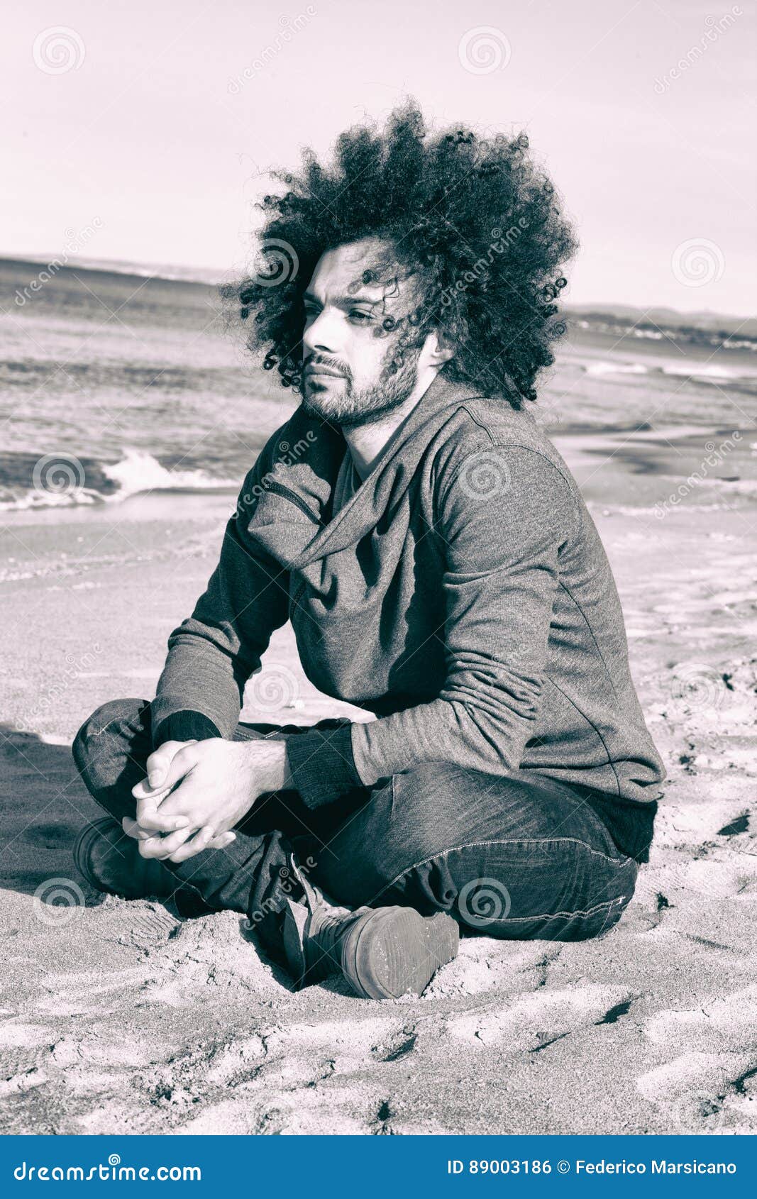 Handsome Sad Man Sitting on Beach Thinking Black and White Stock Photo ...