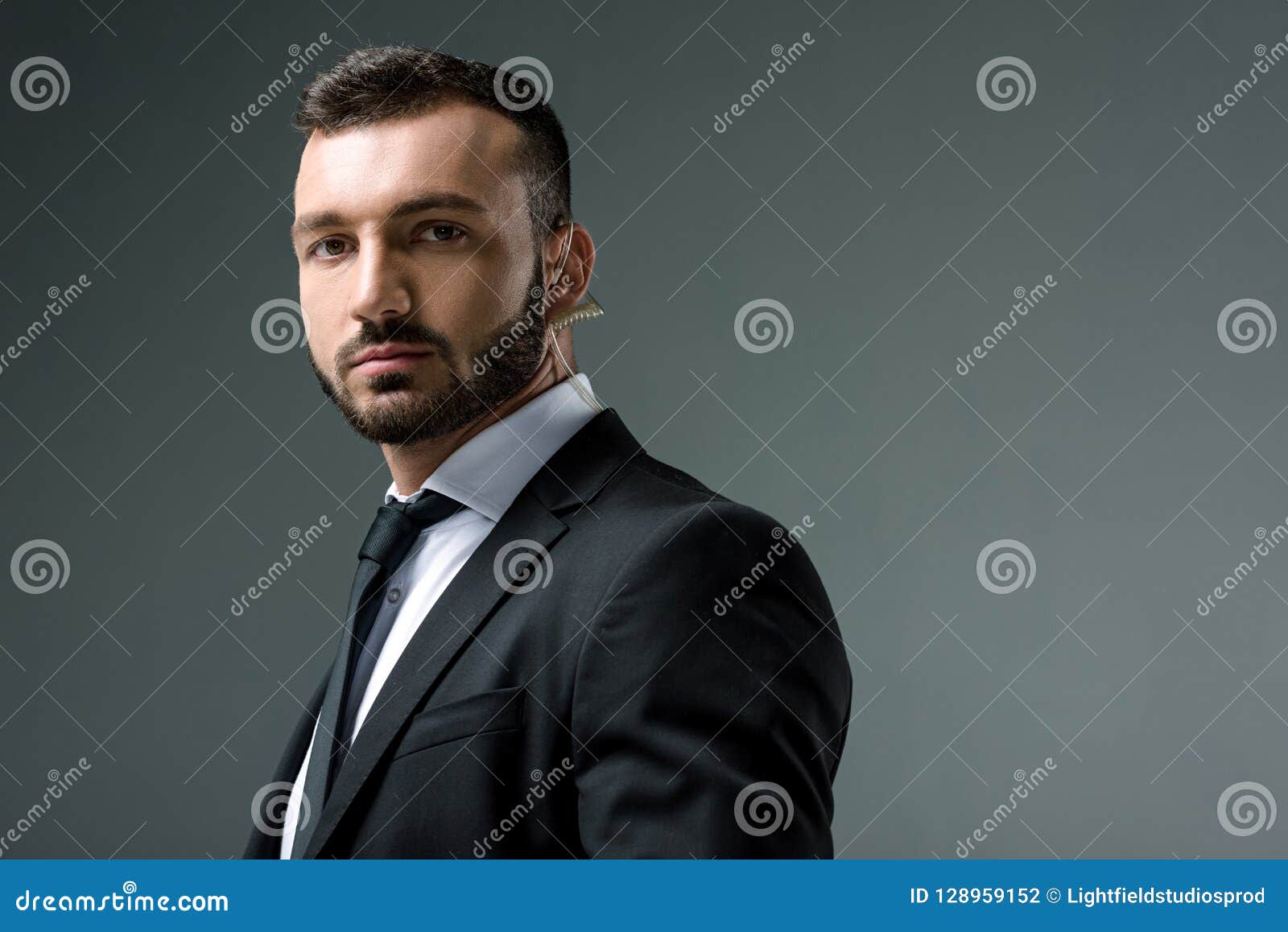 Handsome Security Guard with Security Earpiece Looking at Camera Stock ...