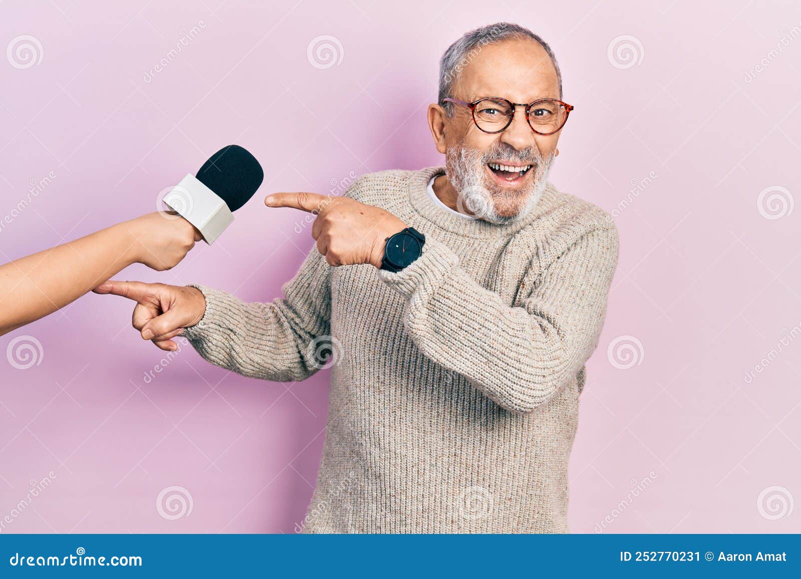 Handsome Senior Man with Beard Being Interviewed by Reporter Holding ...