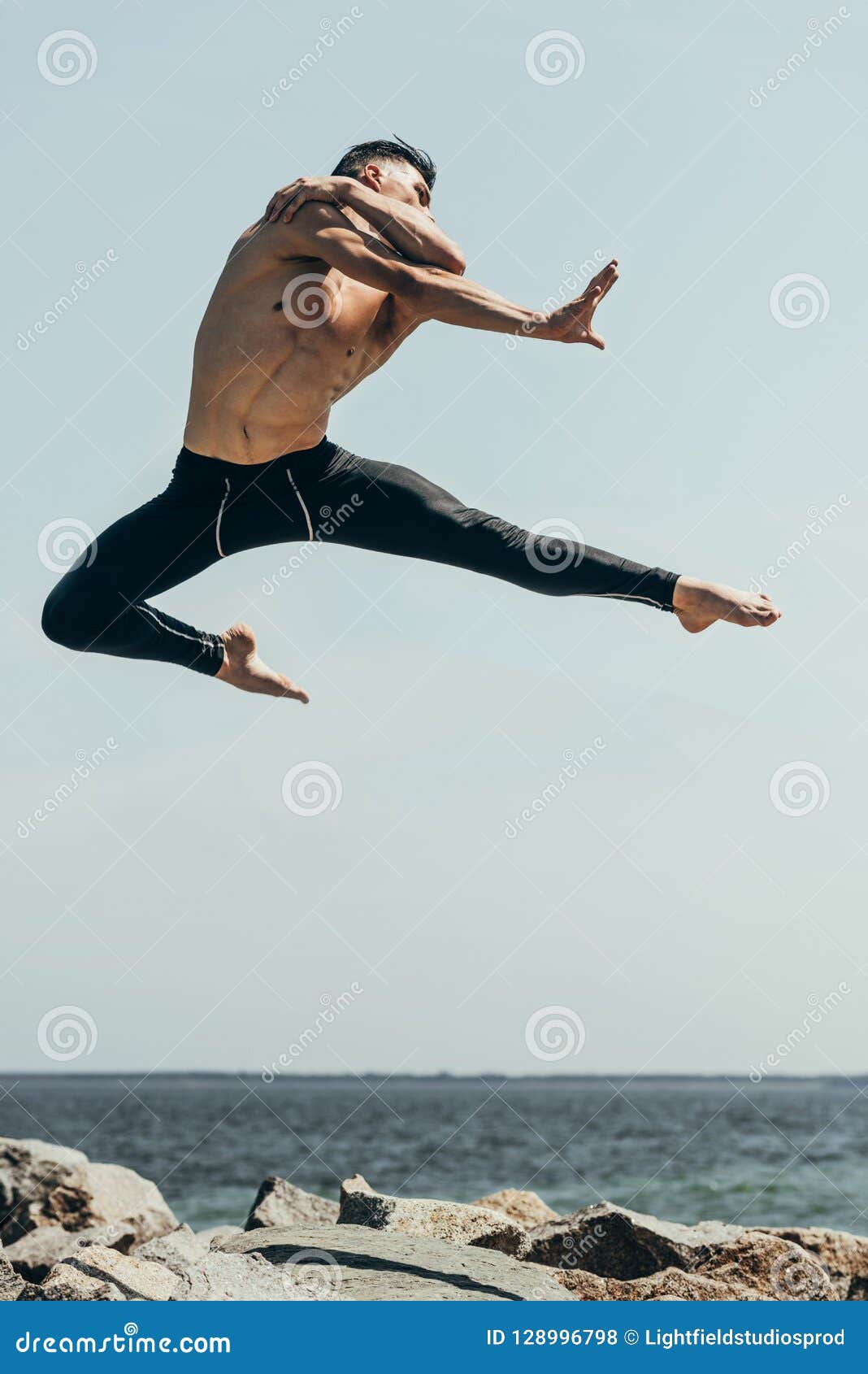 Handsome Shirtless Dancer Jumping Over Stock Photo - Image of ...