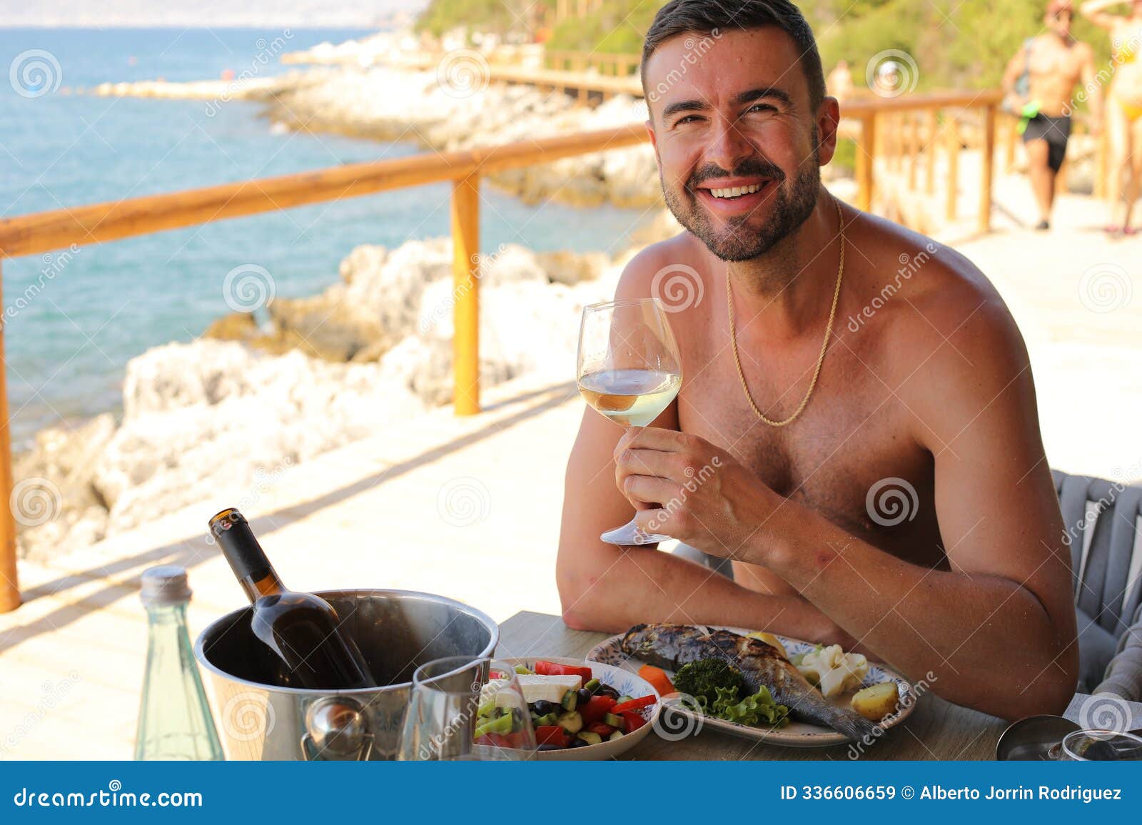 Handsome Shirtless Man Eating Fresh Grilled Fish at a Beach Stock Image ...
