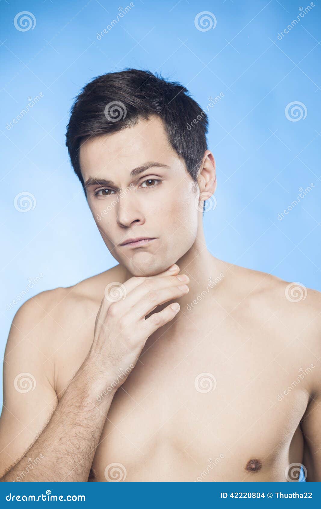 Handsome Shirtless Man in Front of Mirror Looking at His Chin Checking ...