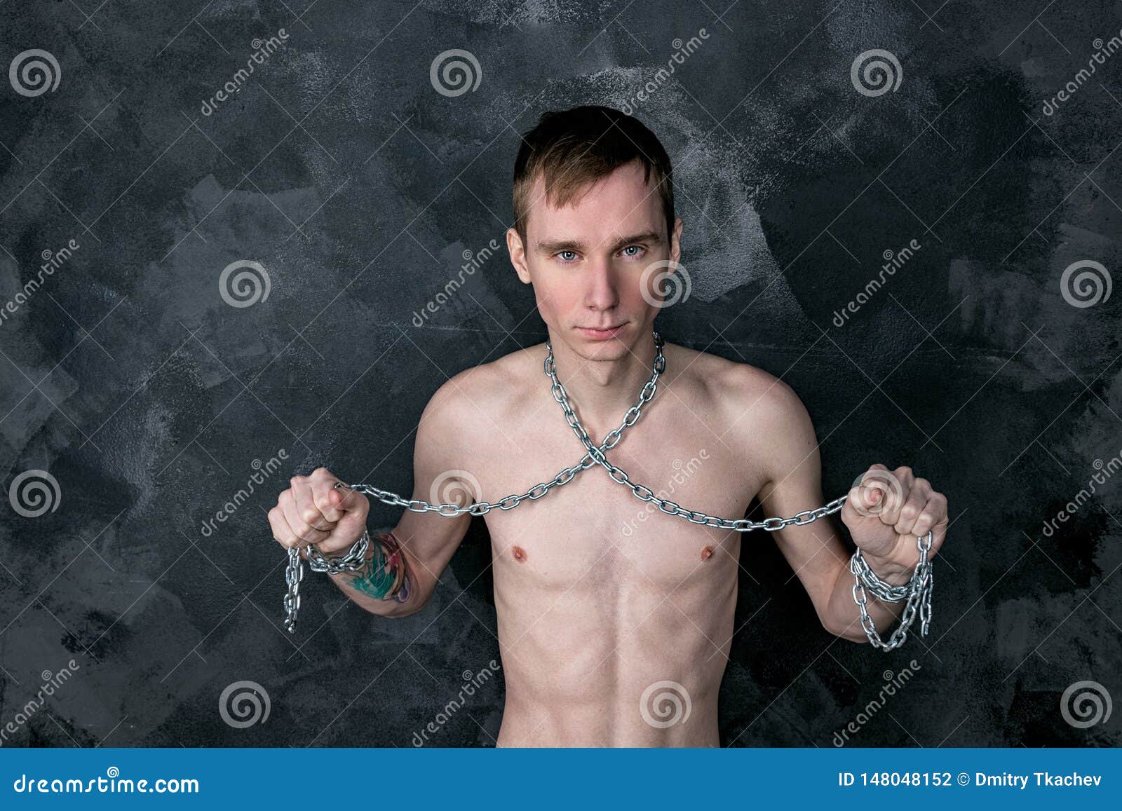 Handsome Skinny Guy Holding a Chain. Black Background Stock Photo ...