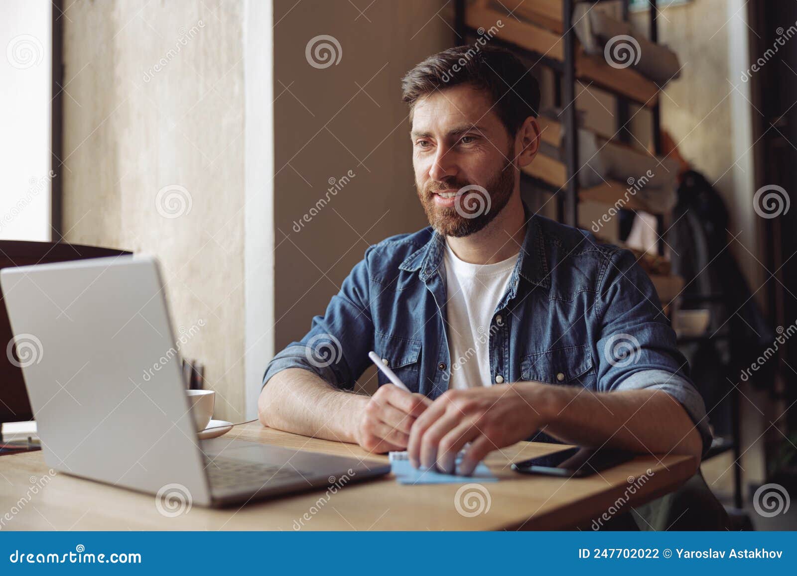 Handsome Smiled Man Taking Notes in Notebook and Working in Cafe at ...