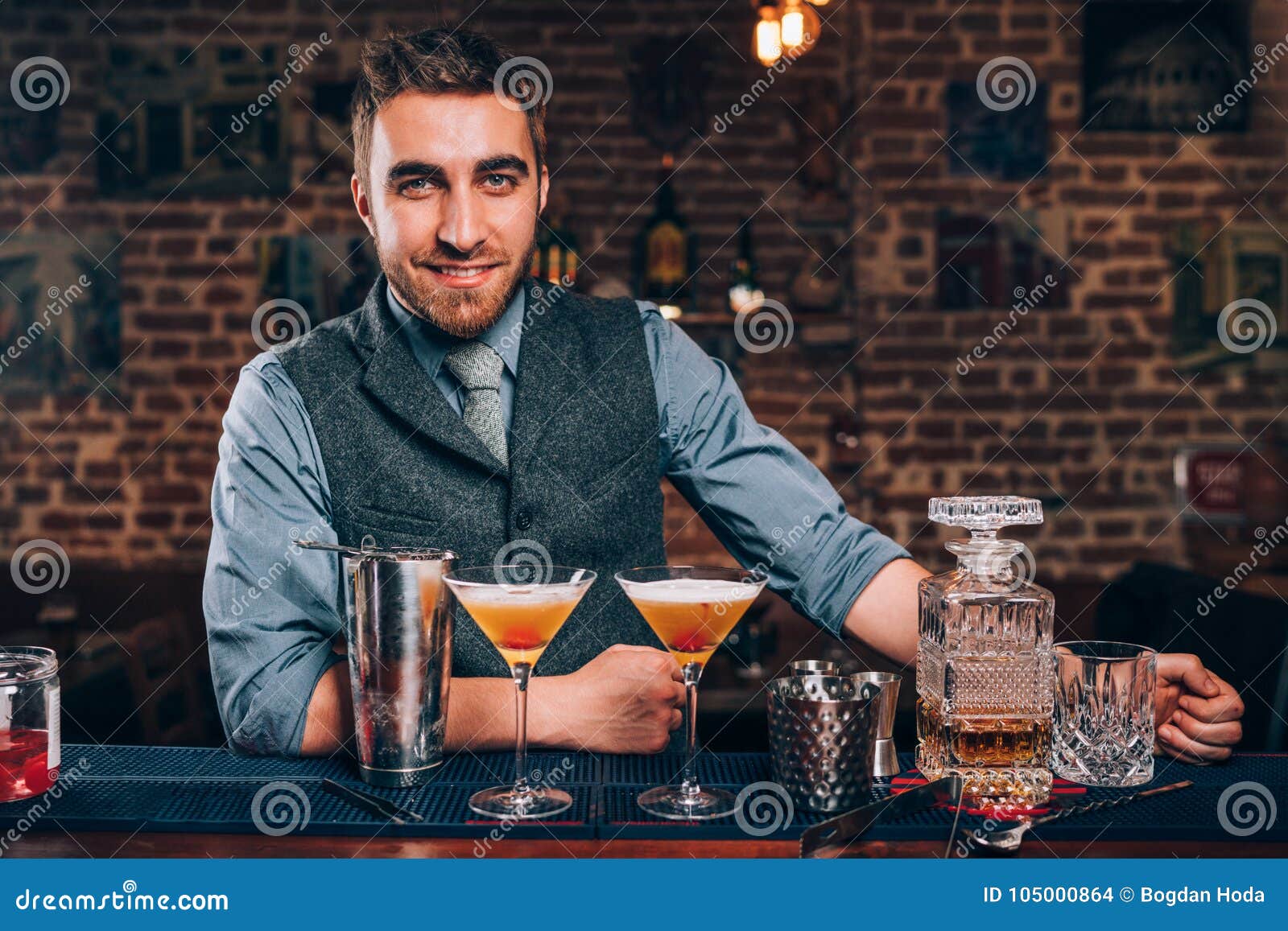 Handsome Smiling Barman Enjoying Work and Preparing Cocktails at Bar ...