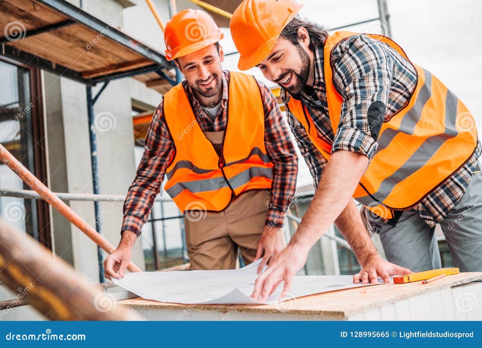 Handsome Smiling Builders Looking Stock Image - Image of blueprint ...