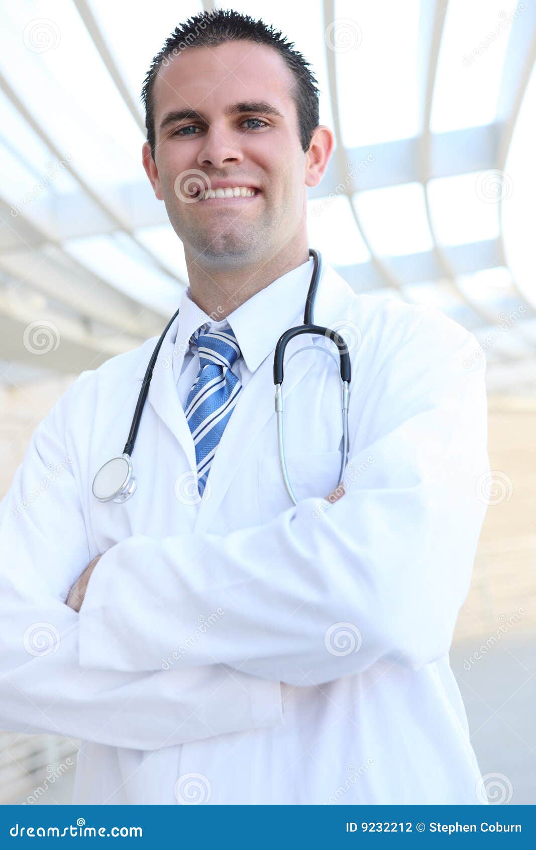 Handsome Smiling Doctor at Hospital Stock Photo - Image of professional ...