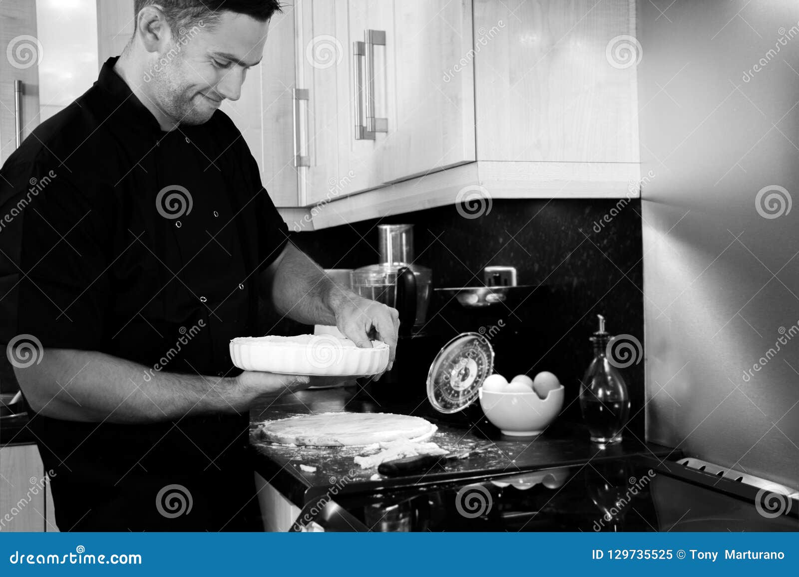 Good Looking Male Chef Presses Pastry into a Dish Stock Image - Image ...