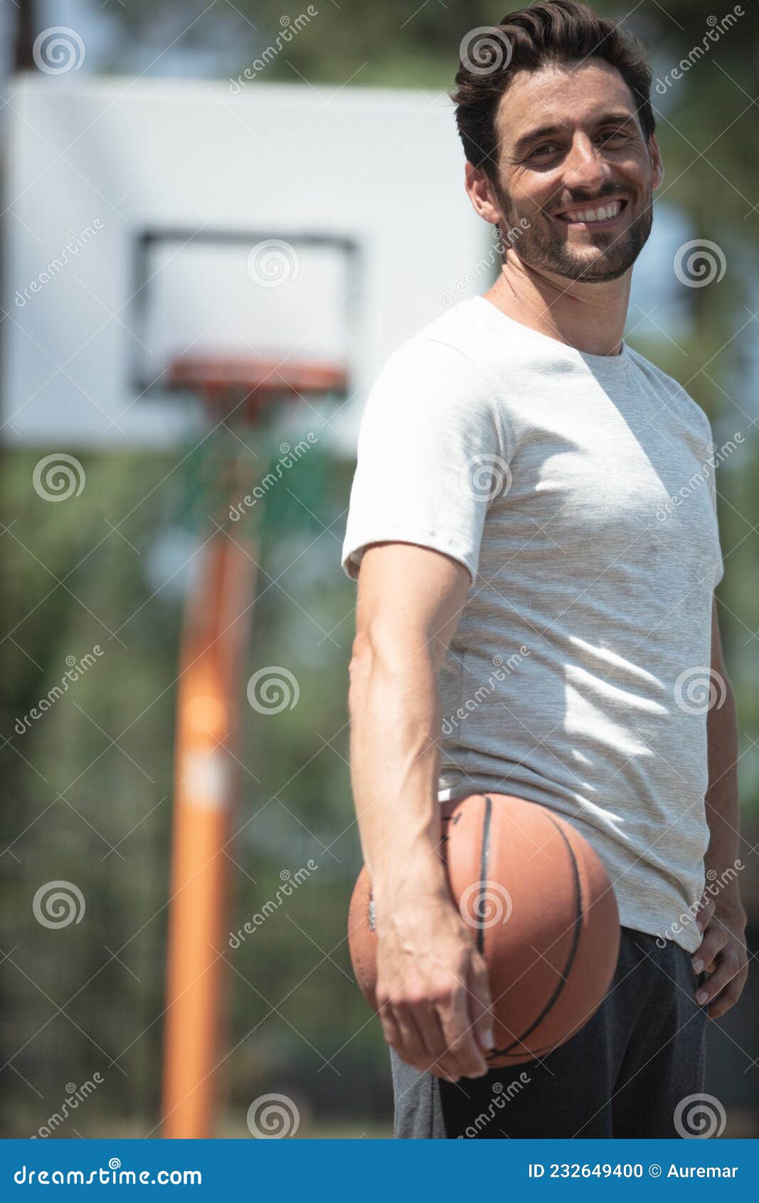 Handsome Smiling Man Carrying Basketball Ball Stock Photo - Image of ...