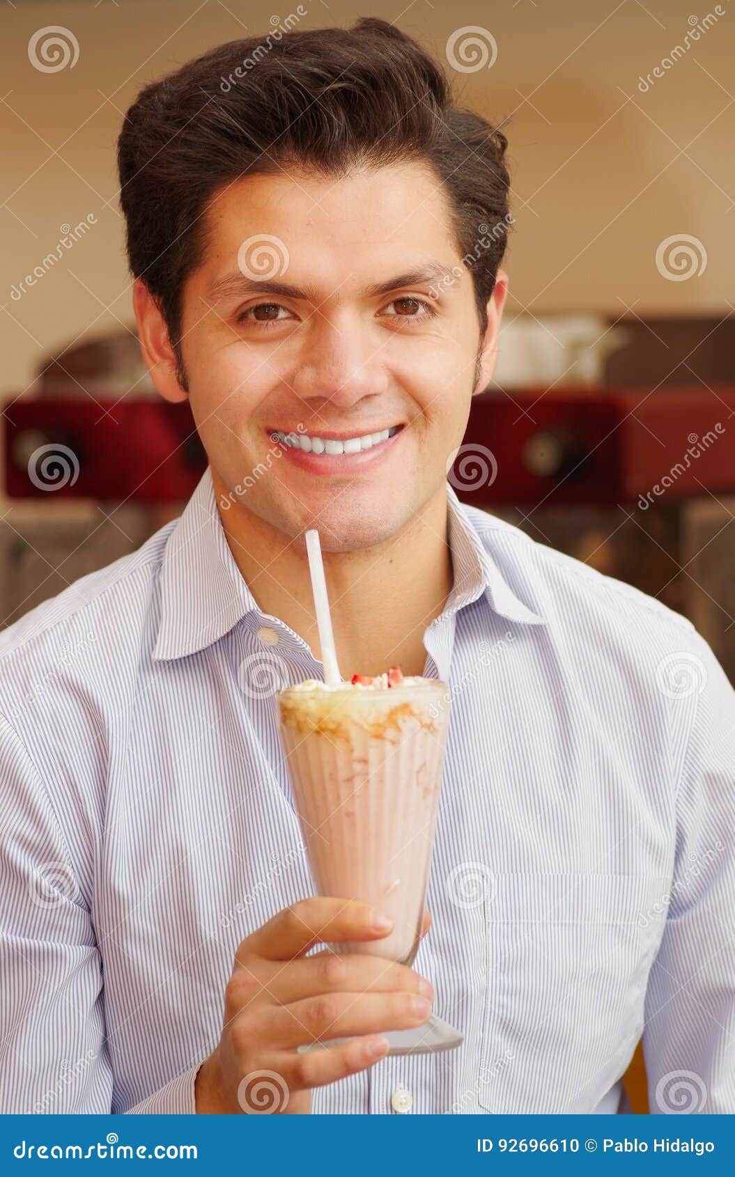 Handsome Smiling Man Having a Milkshake with a Plastic Straw Stock ...