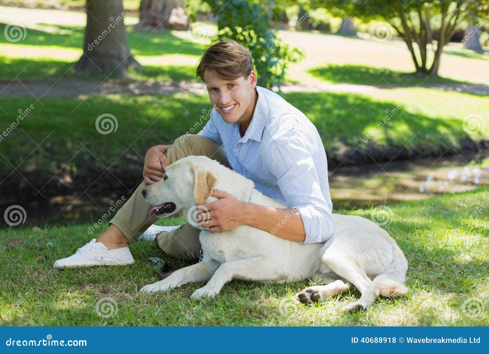 Handsome Smiling Man with His Labrador in the Park Stock Photo - Image ...