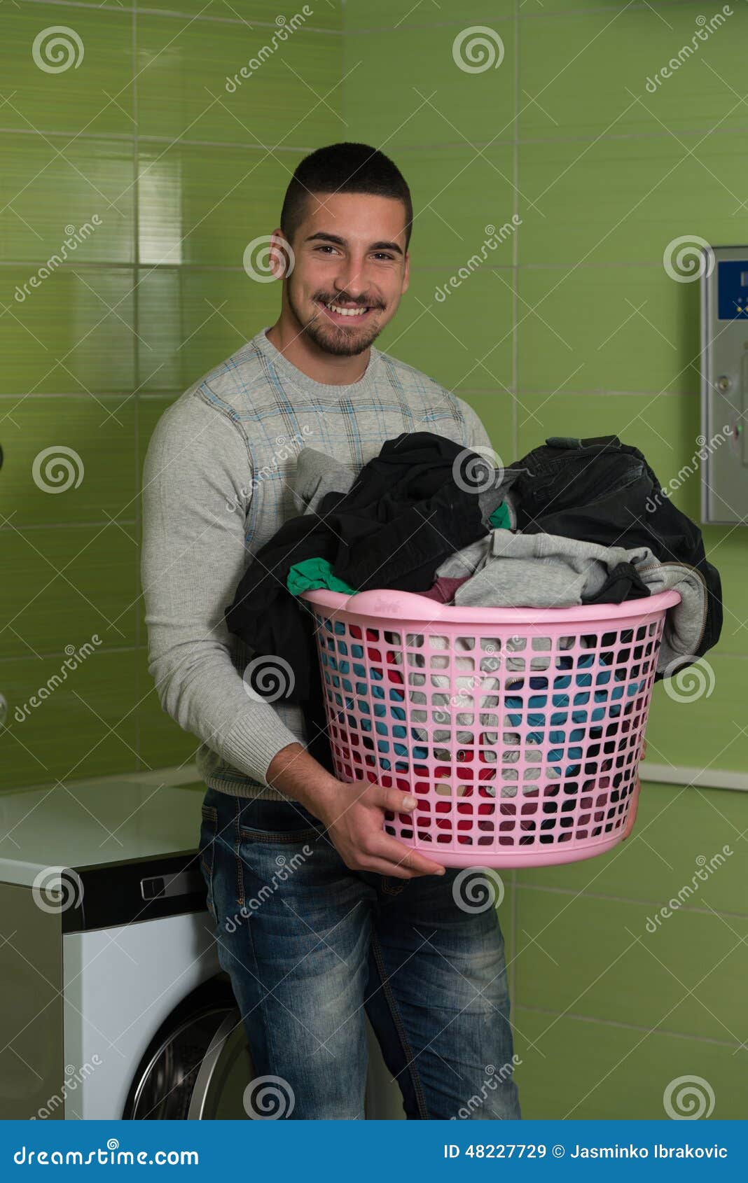 Handsome Smiling Man in the Laundry Room Stock Image - Image of routine ...