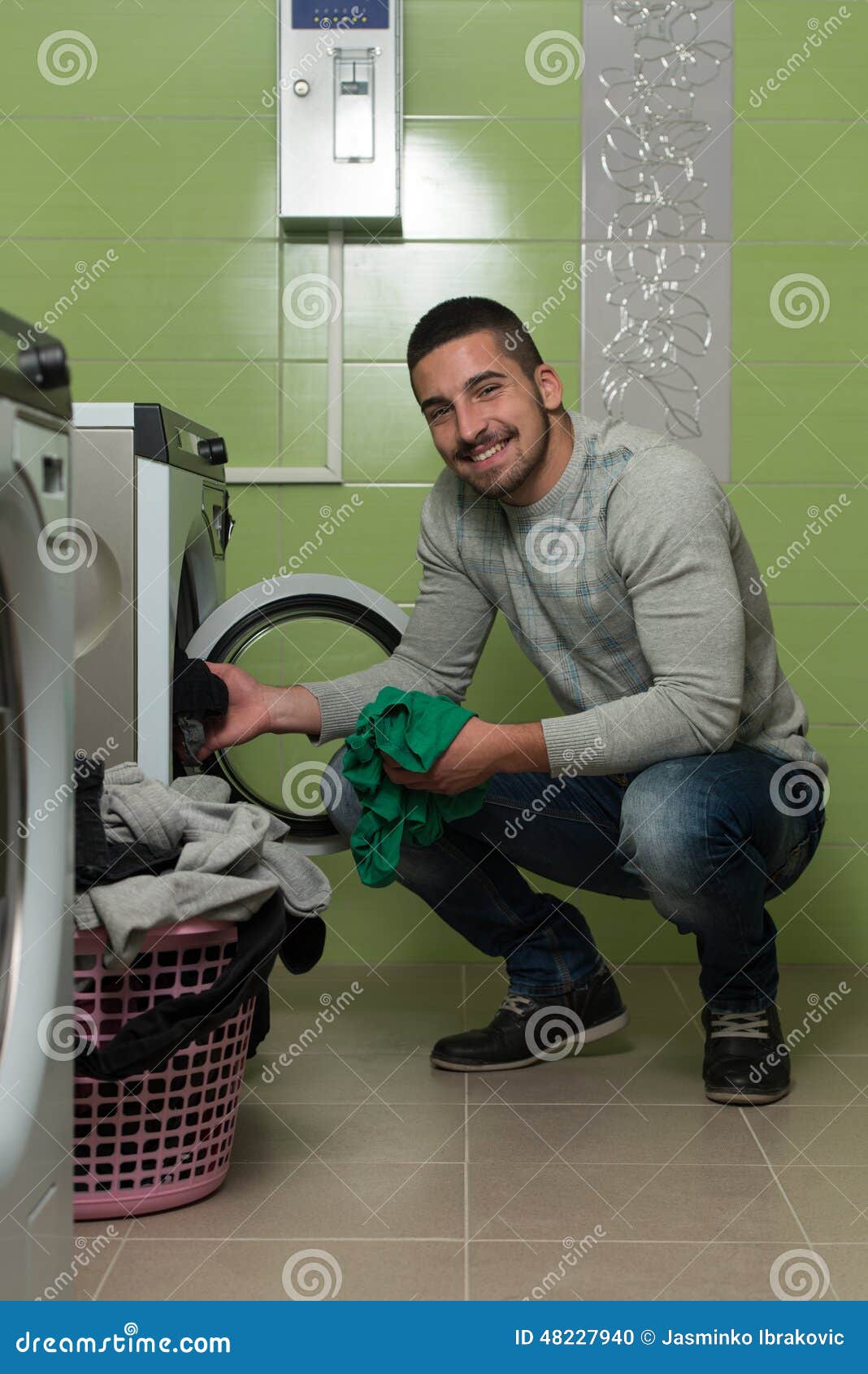 Handsome Smiling Man in the Laundry Room Stock Photo - Image of ...