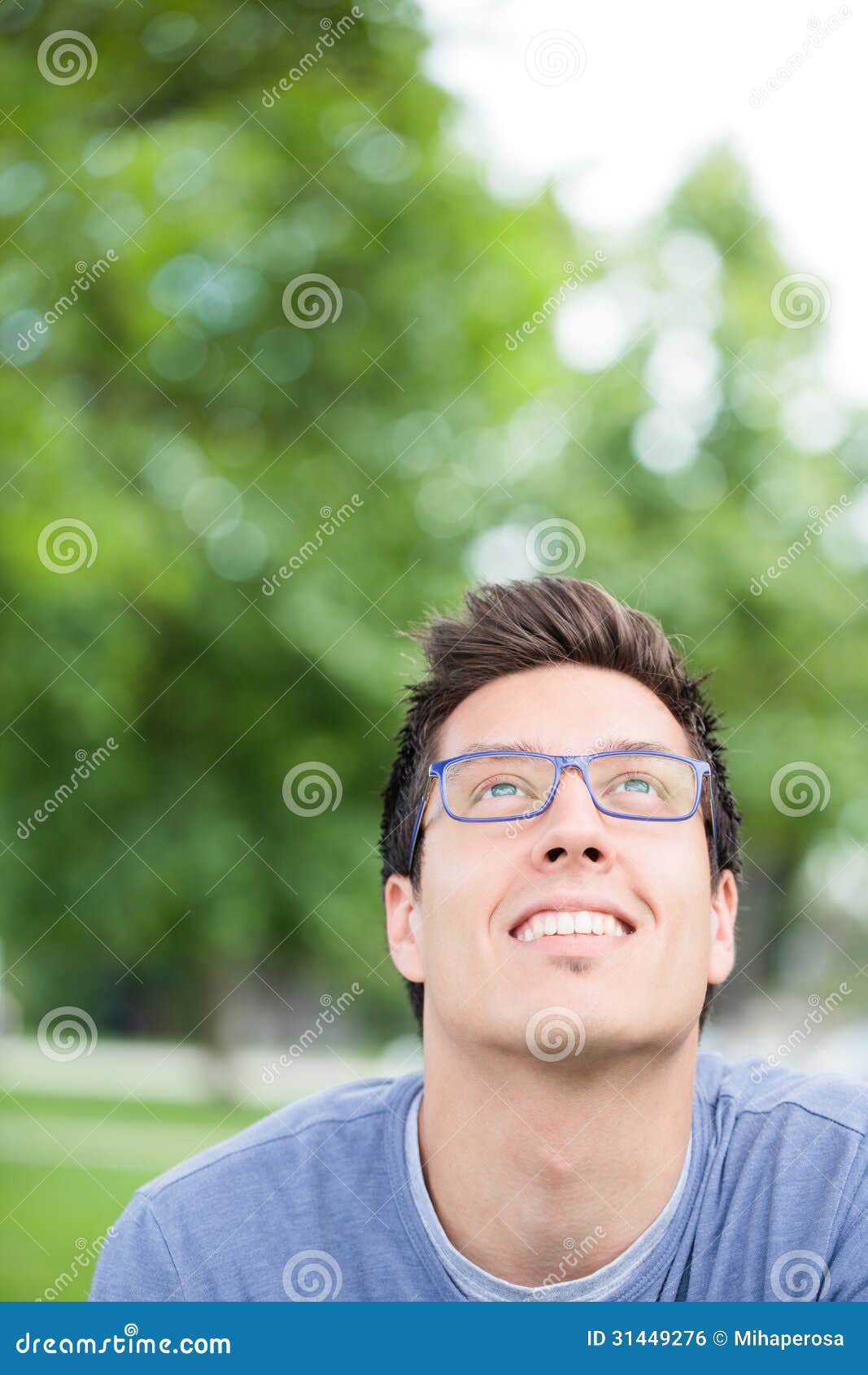 Handsome Smiling Man Looking Up in the Park Stock Photo - Image of ...
