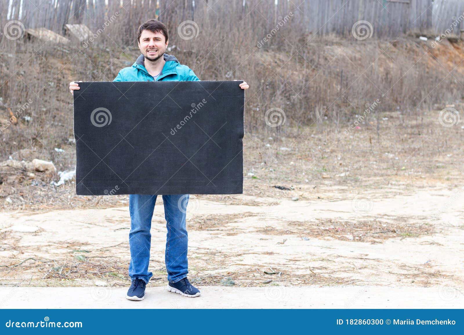 Handsome Smiling Man with a Rectangular Black Piece of Dense Fabric in ...