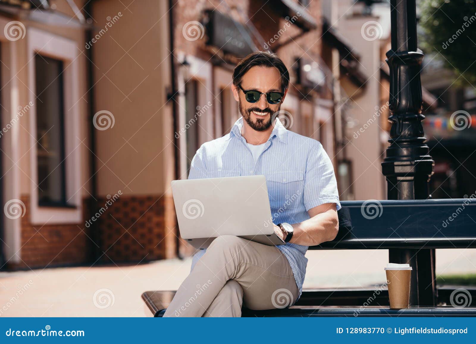 Handsome Smiling Man Sitting on Bench Stock Photo - Image of selective ...