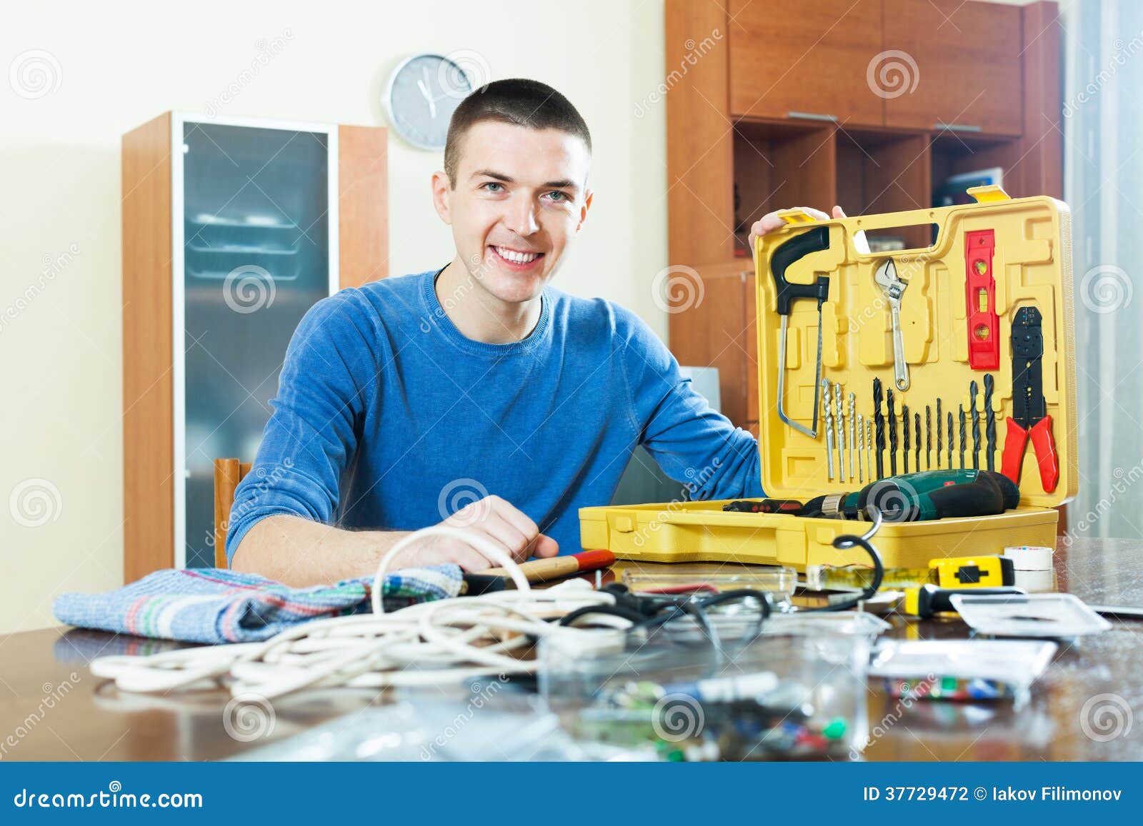Handsome Smiling Man Sitting by Toolbox Stock Photo - Image of adult ...