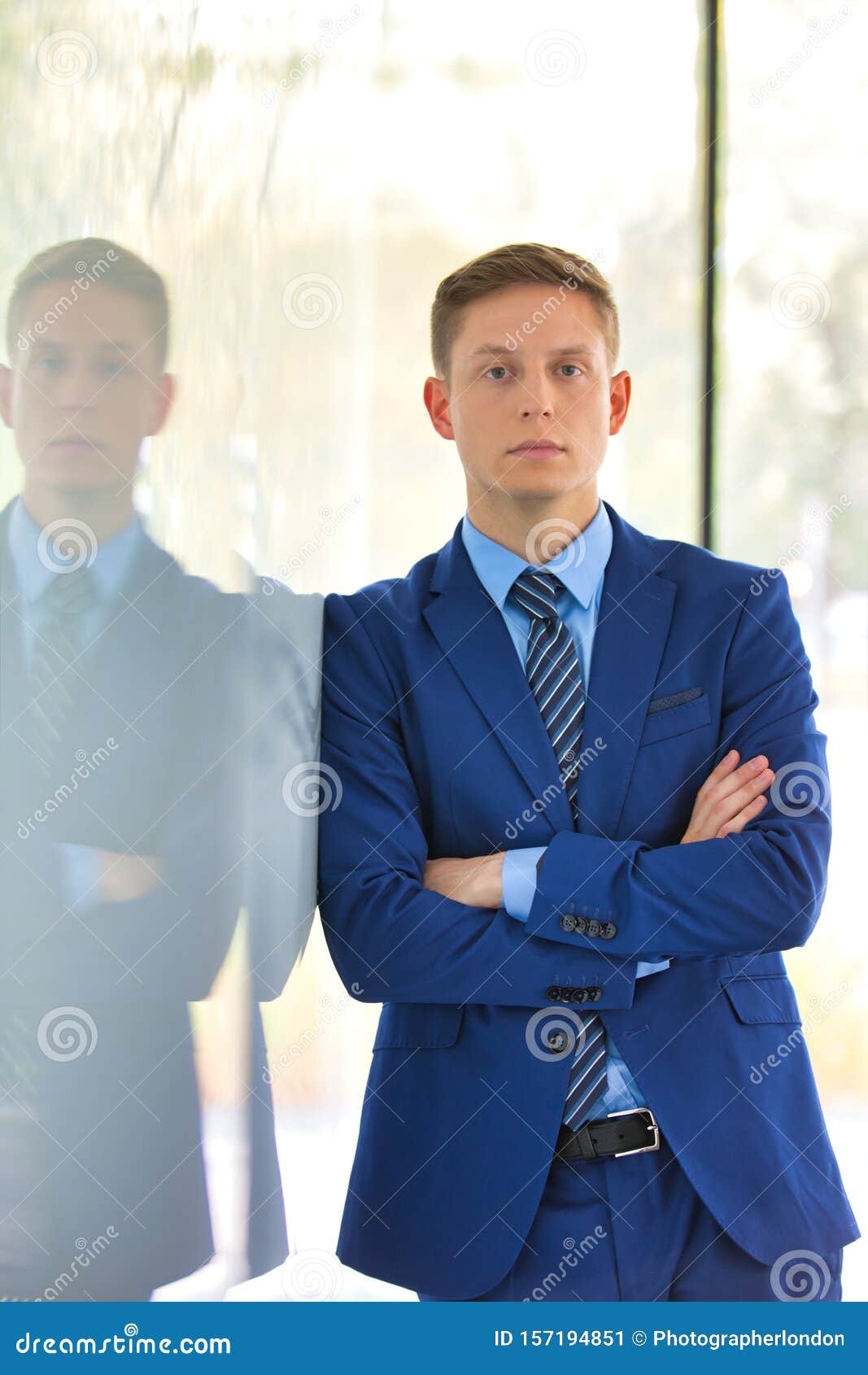 Portrait of Handsome Smiling Young Businessman with Arms Crossed ... Portrait of Handsome Smiling Young Businessman with Arms Crossed ...